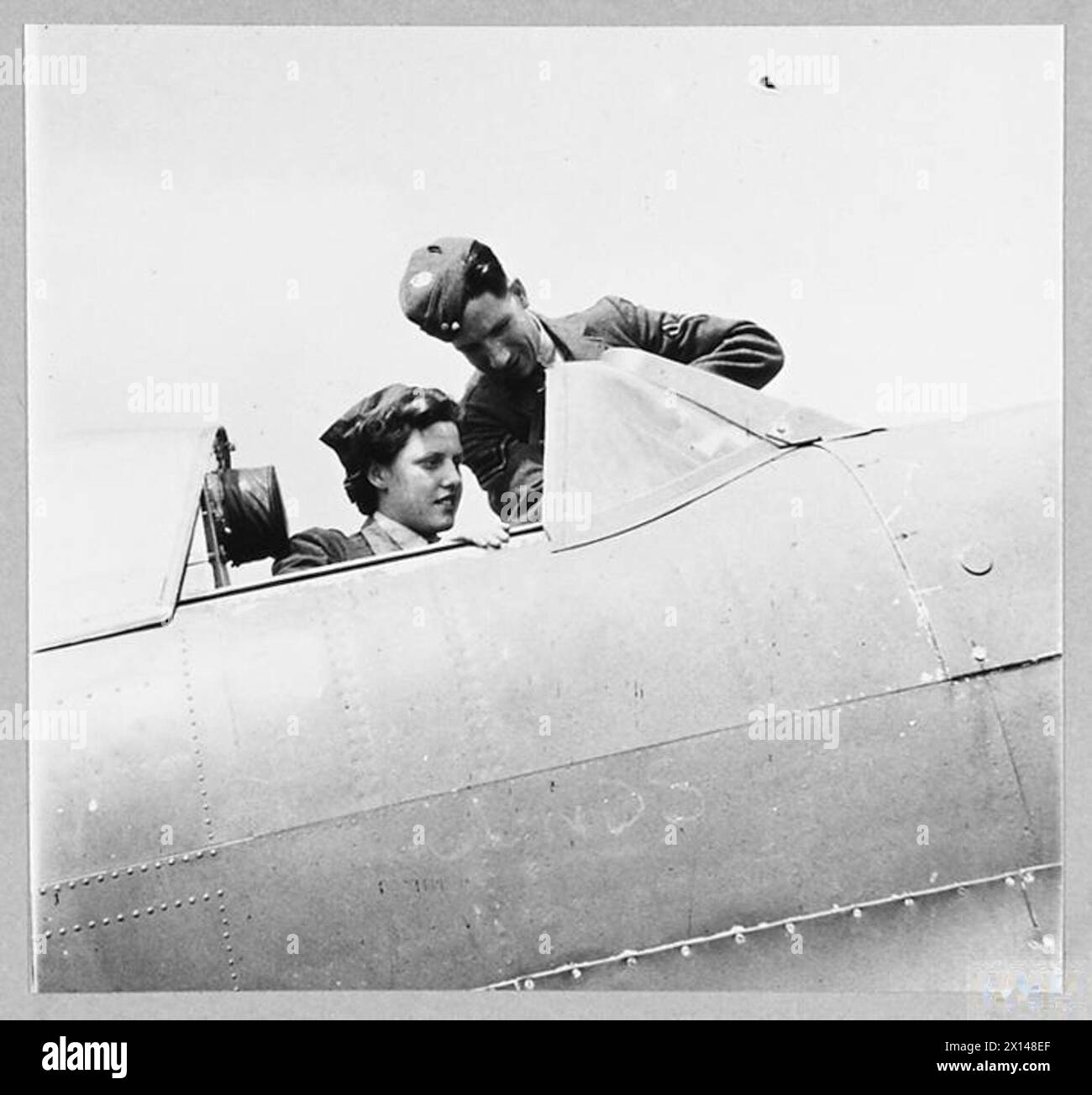 W.A.A.F. FLIGHT MECHANICS - Instruction in the cockpit of a Spitfire on ...