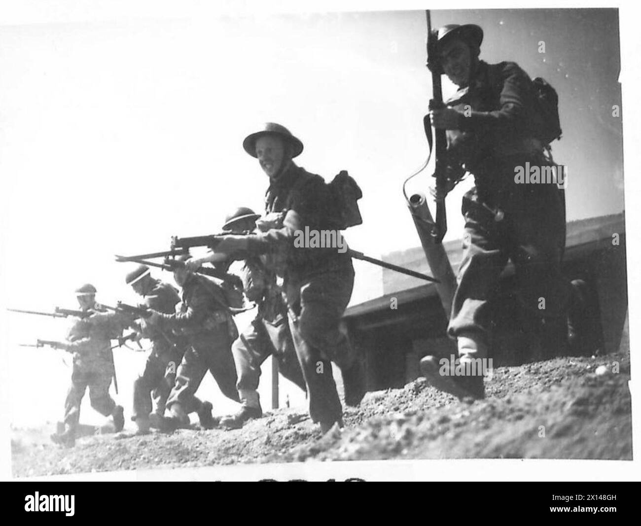 British Army troops advance over cliff tops as part of coastal defense ...