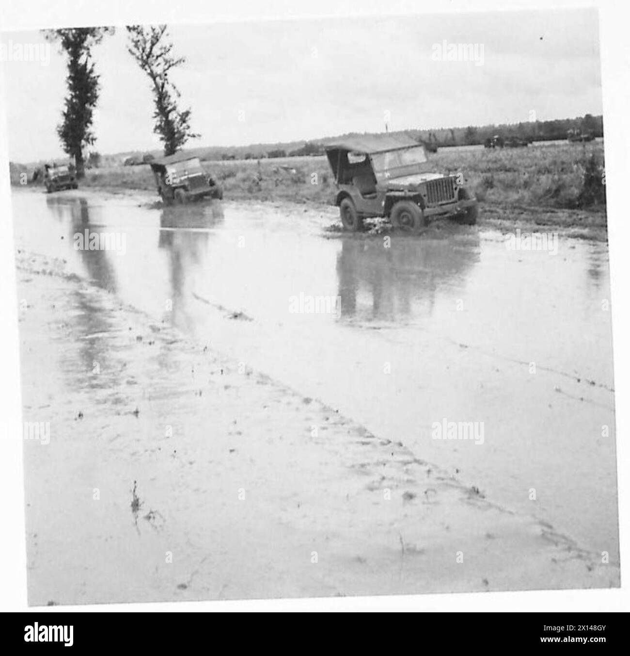 FLOODS IN NORMANDY - Vehicles making their way through the flooded ...