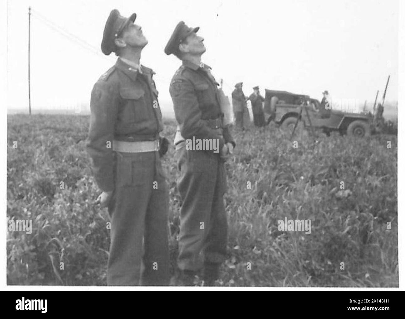VICTORY SALVO! 21 ARMY GROUP CEASE-FIRE - [Left] Major General M.E ...