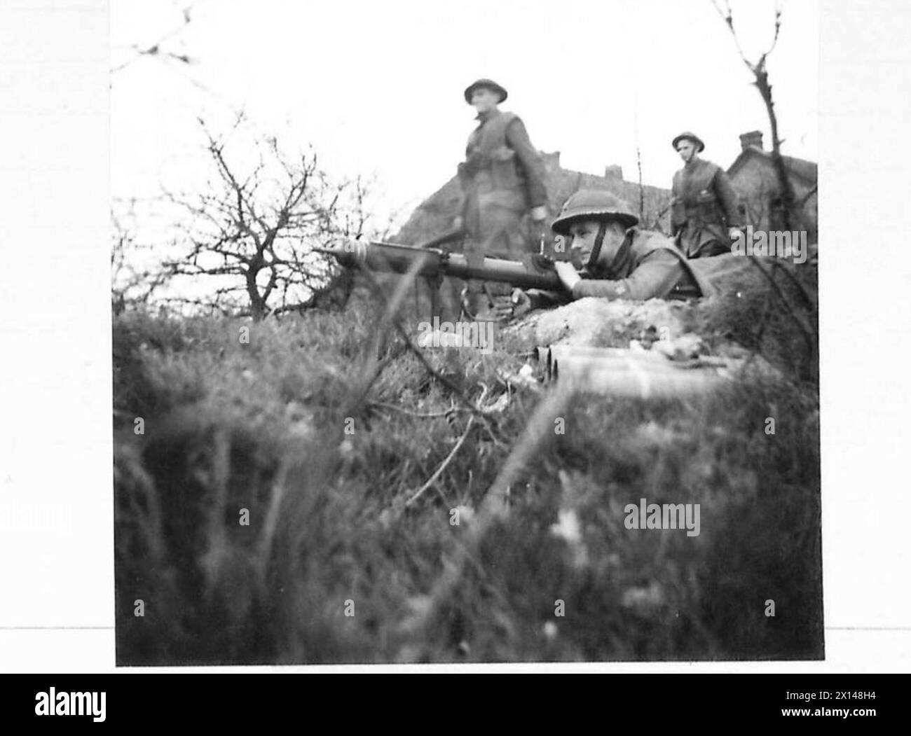 ADVANCE TOWARDS ANHOLT - Pte.F.Webb of Gloucester gives covering fire ...