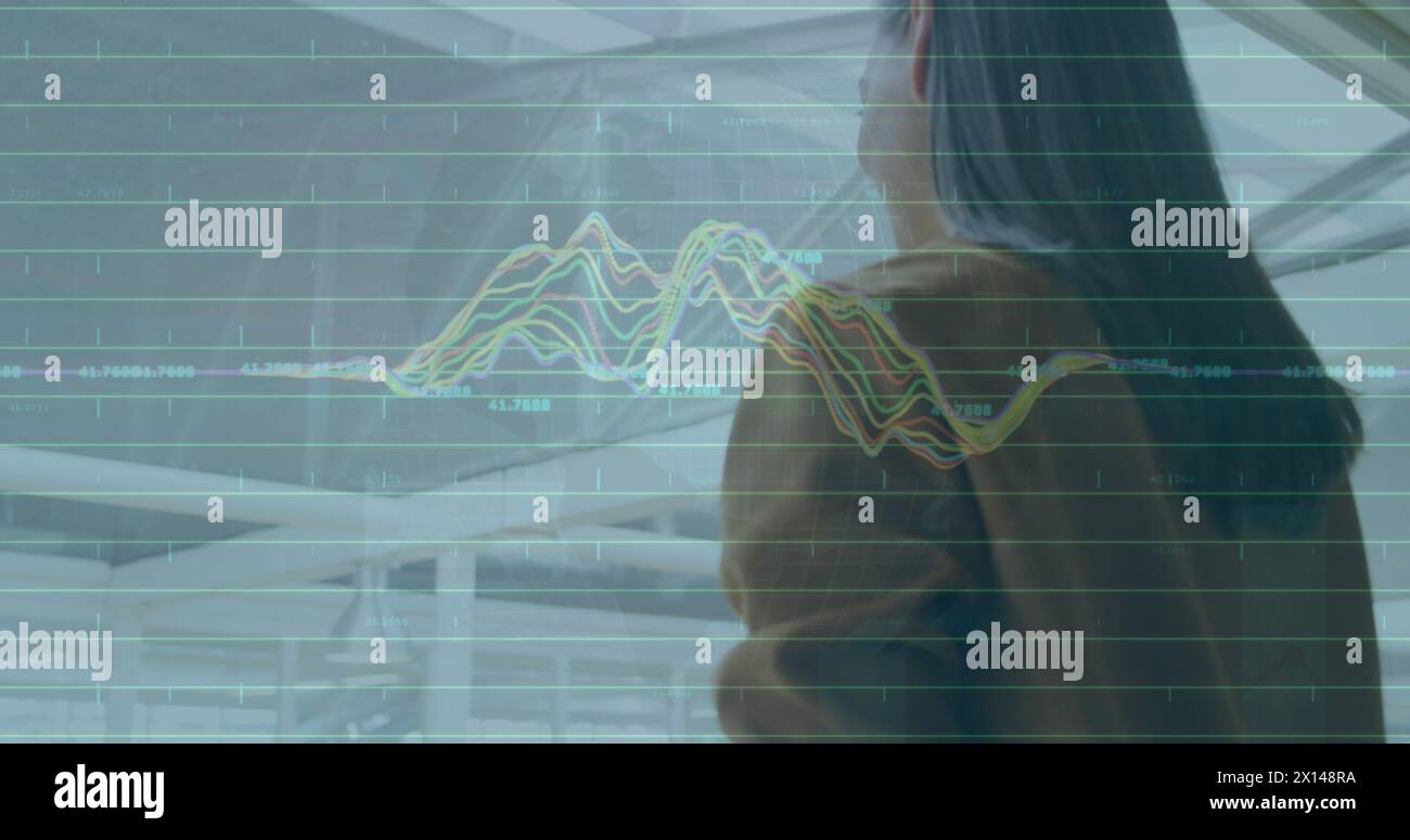 Image of multicolored graphs, numbers, biracial woman talking on ...