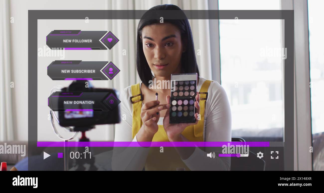 Image of social media data and icons over biracial woman on makeup vlog ...