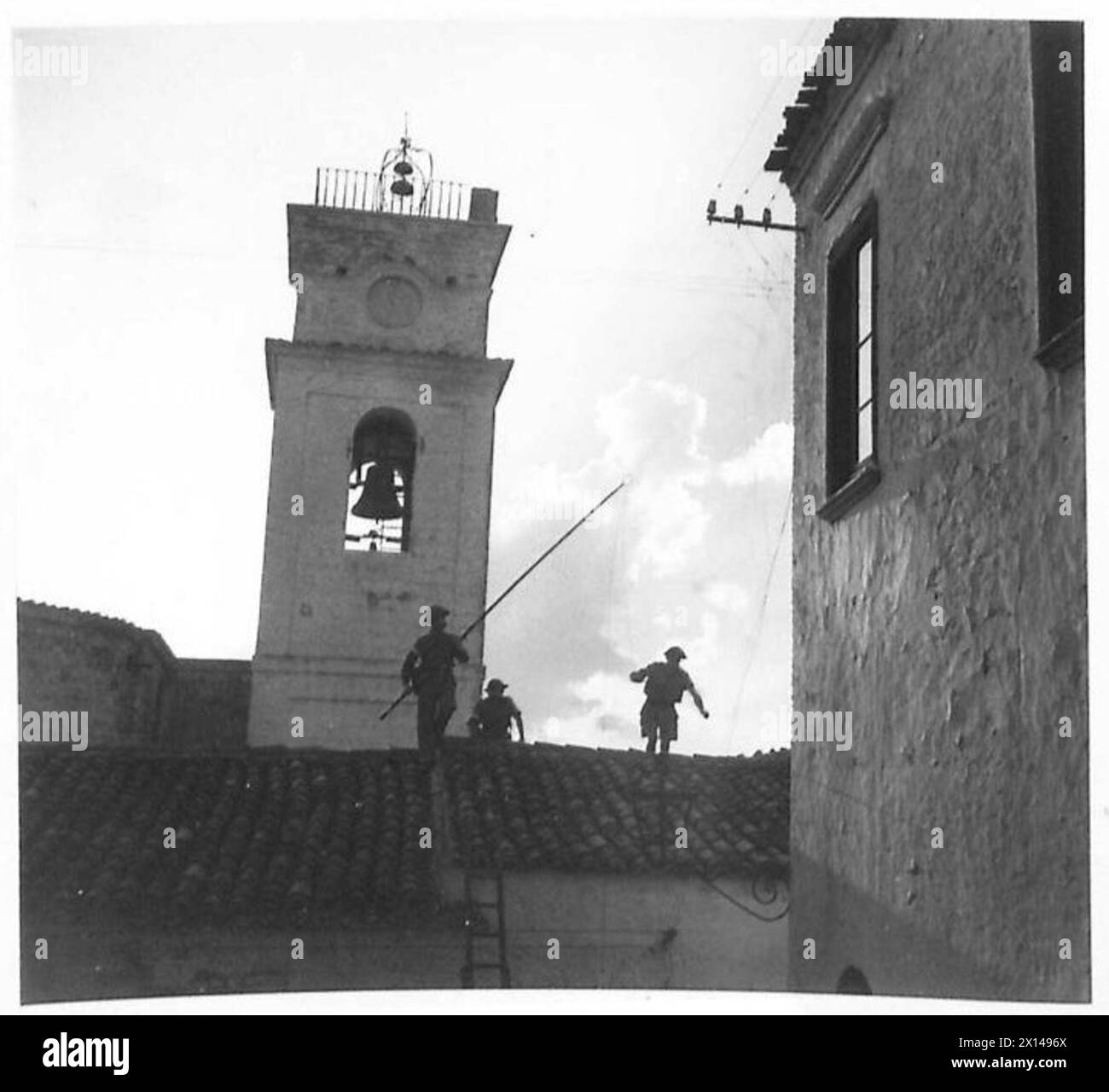 Royal Signals linesmen work on rooftops in Italy, maintaining ...