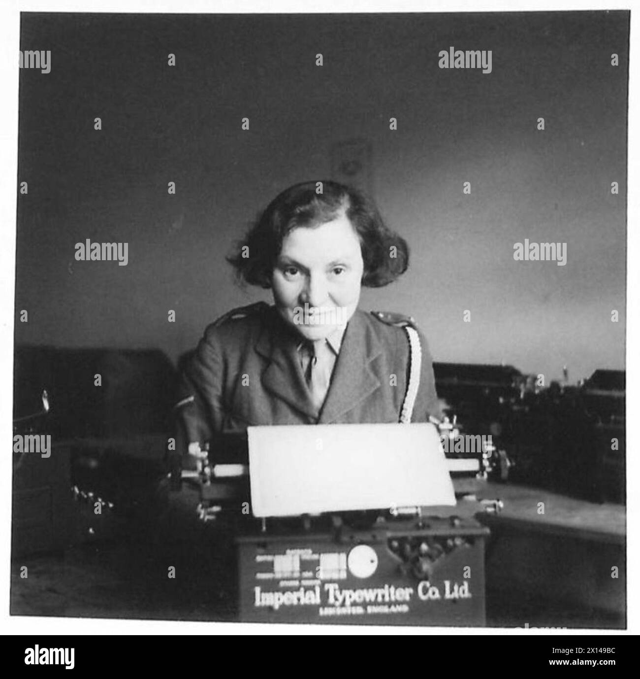 TRAINING SCHOOL FOR ATS CLERKS - L/Cpl. Berthe Tinker seated at her ...