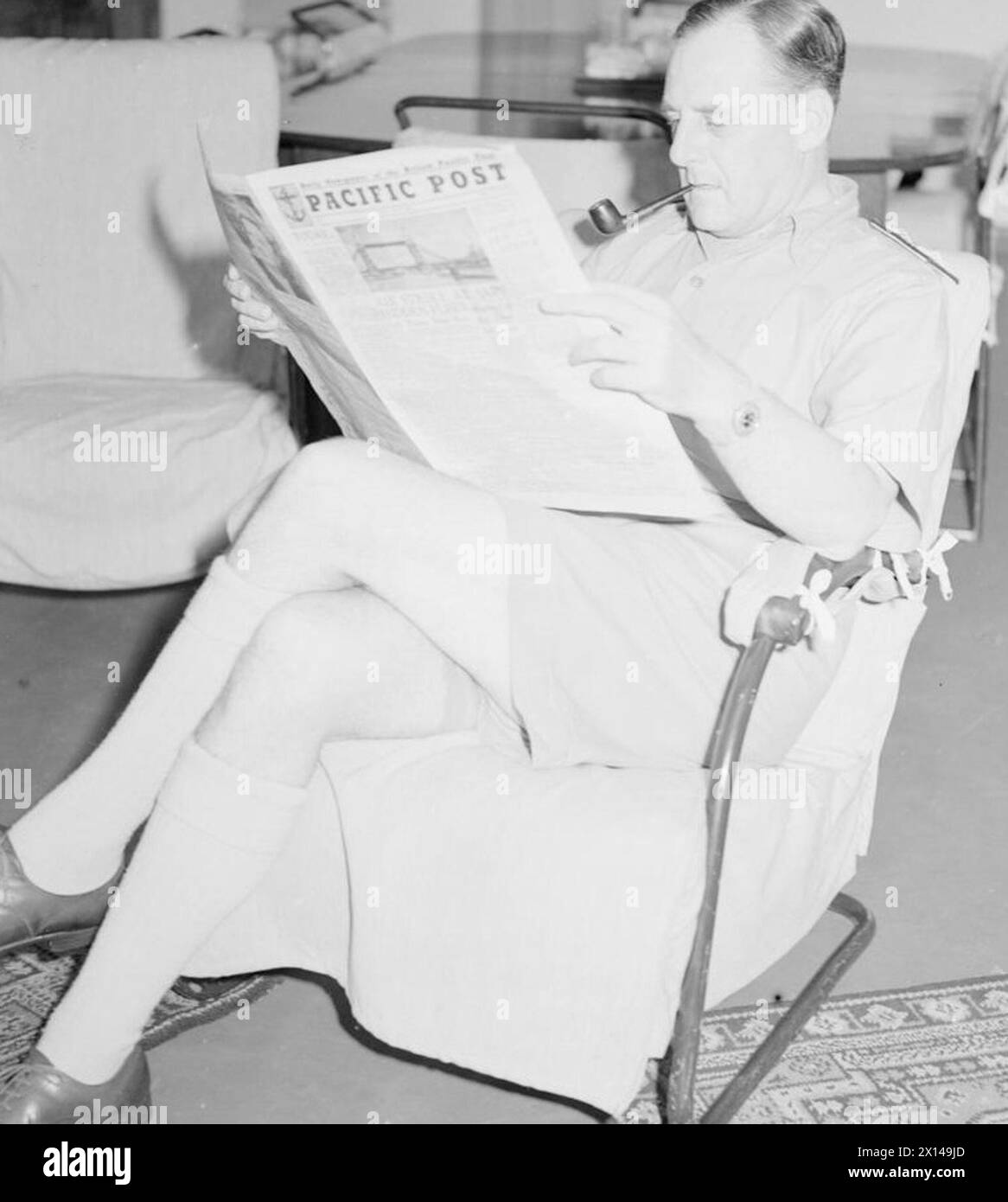 Rear Admiral D. B. Fisher, RN, reads the British Pacific Fleet's ...