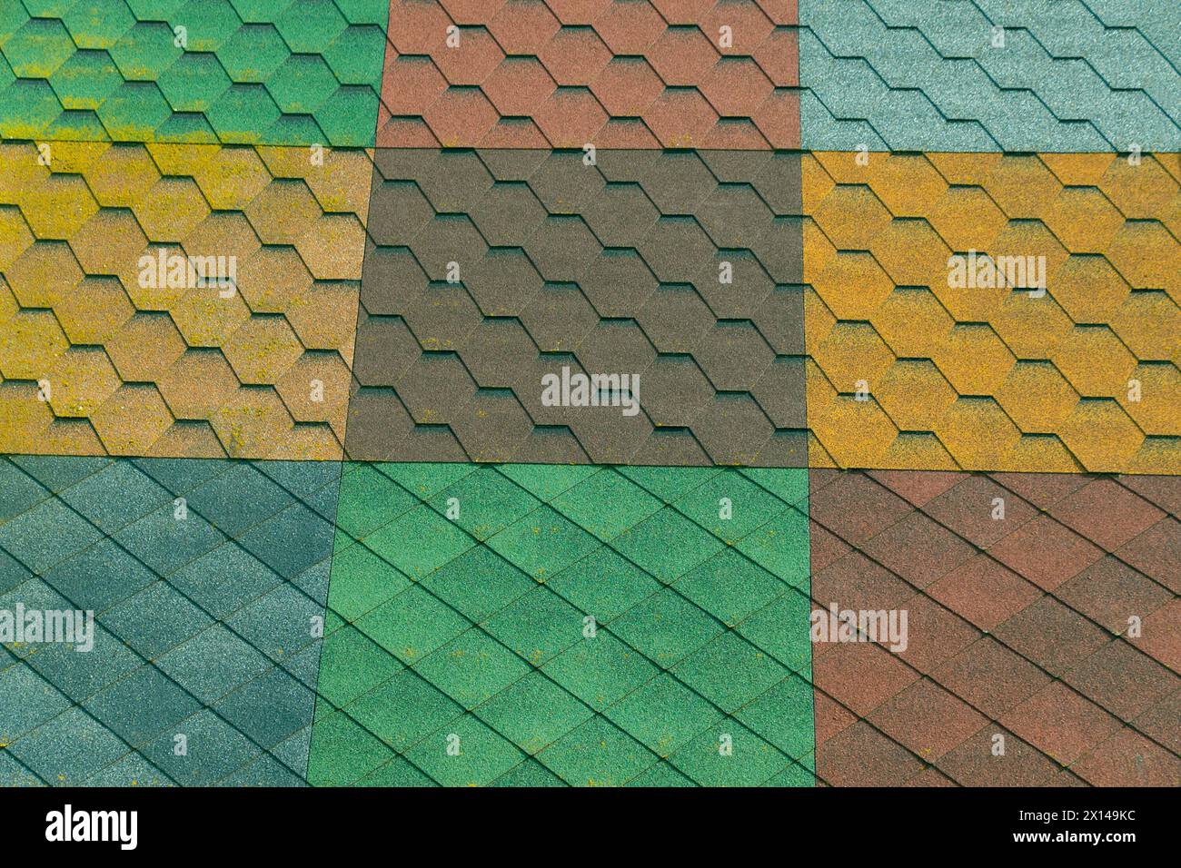 Multi-colored tiles on the roof of a building. Construction Materials ...