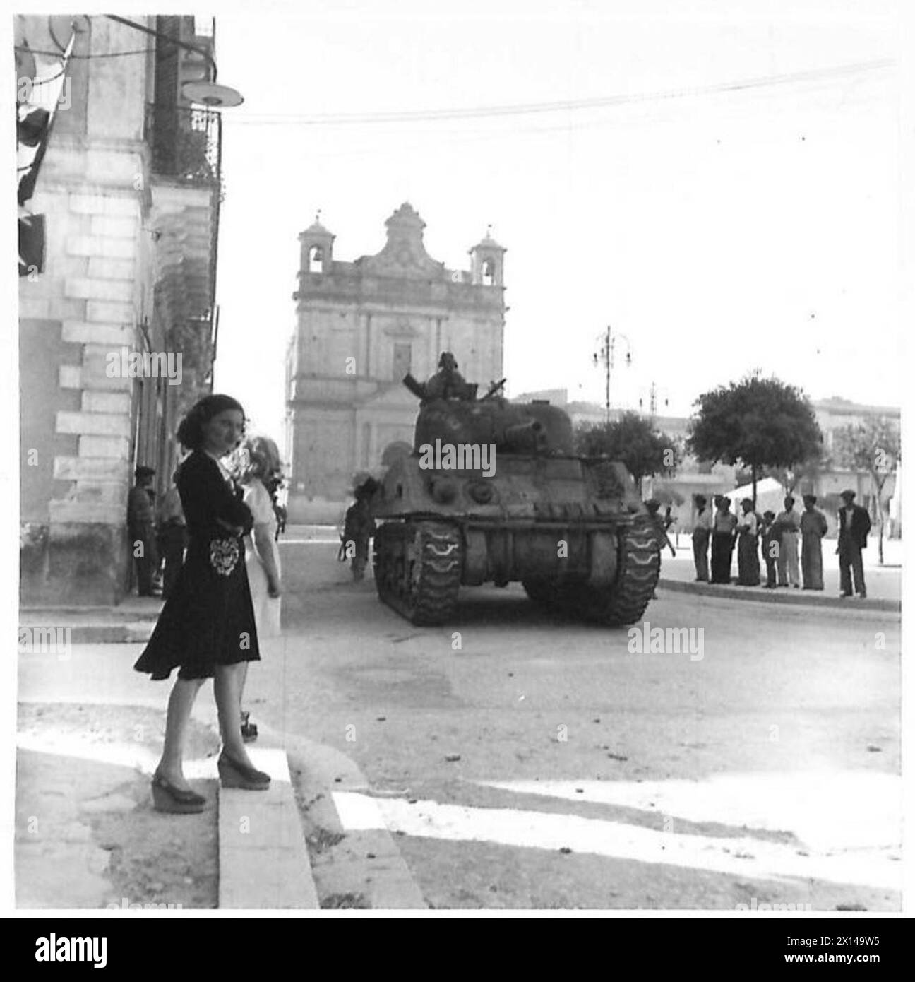 SCENES IN PACHINO DURING THE ADVANCE OF OUR TROOPS - A British tank ...