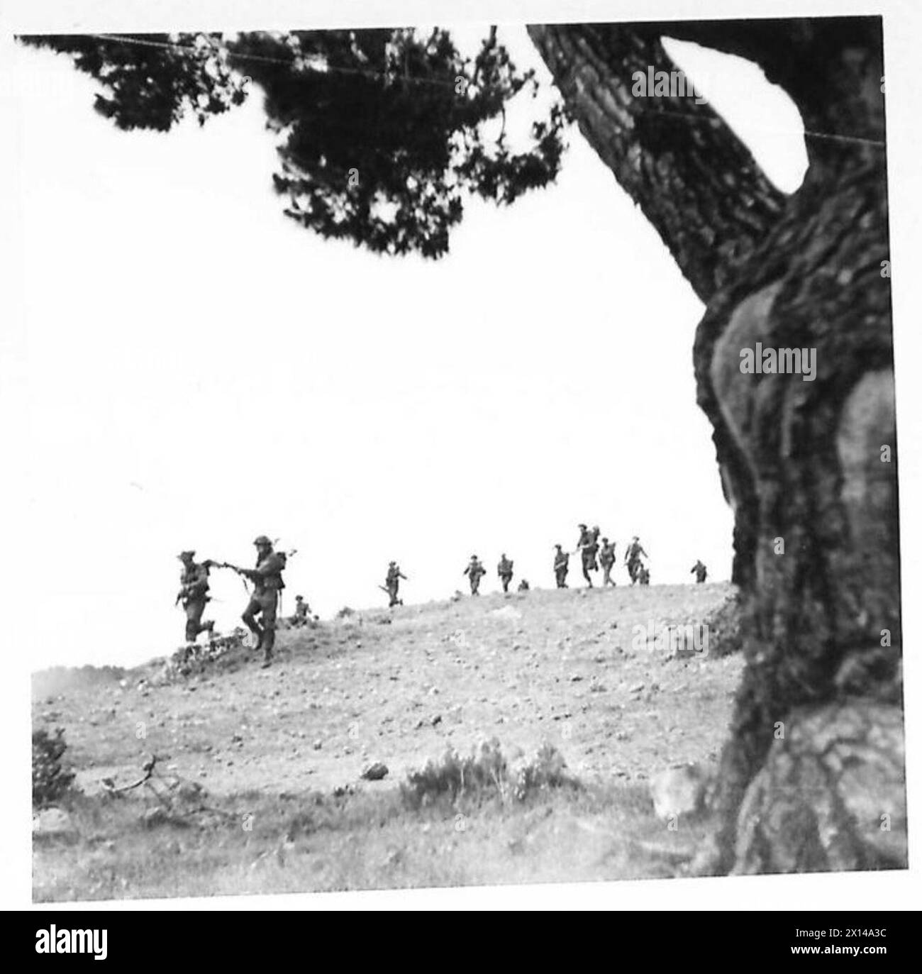 First Army Coldstream soldiers performing a bayonet charge over a hill ...