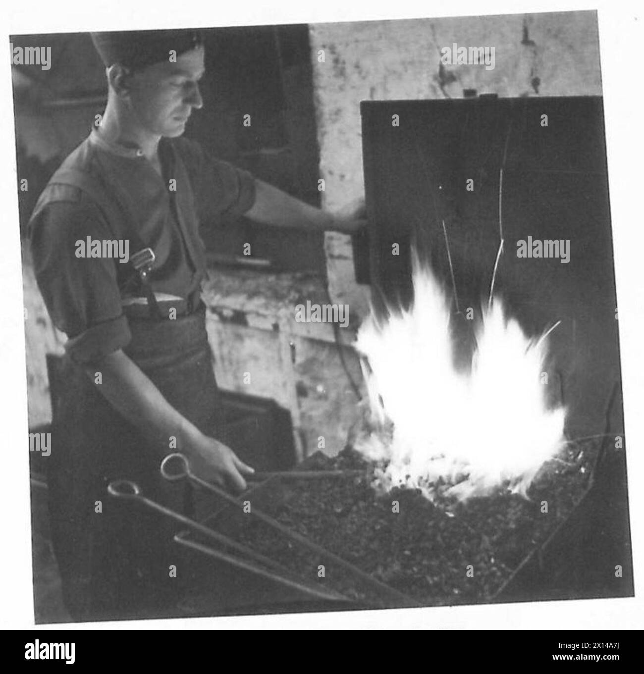 WITH THE ROYAL ENGINEERS IN NORTH AFRICA - Sapper heating a ship's rail ...