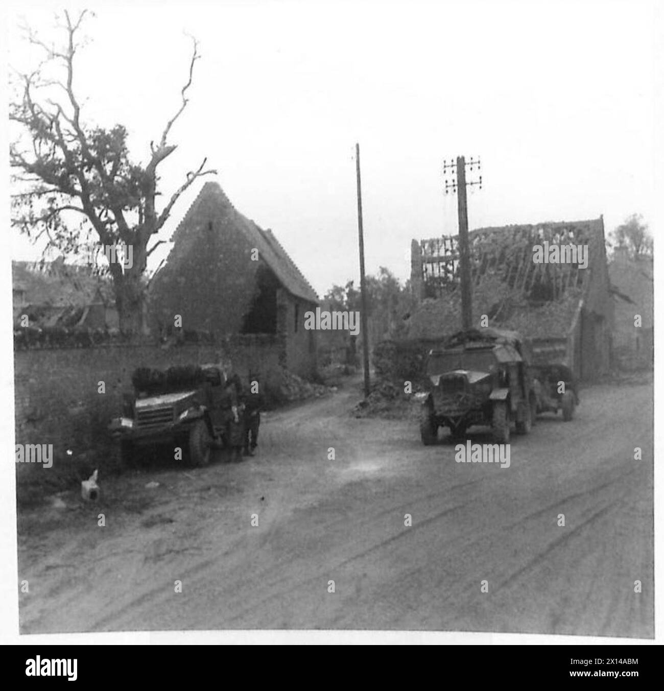 Allied vehicles of the British Army 21st Army Group are shown passing ...