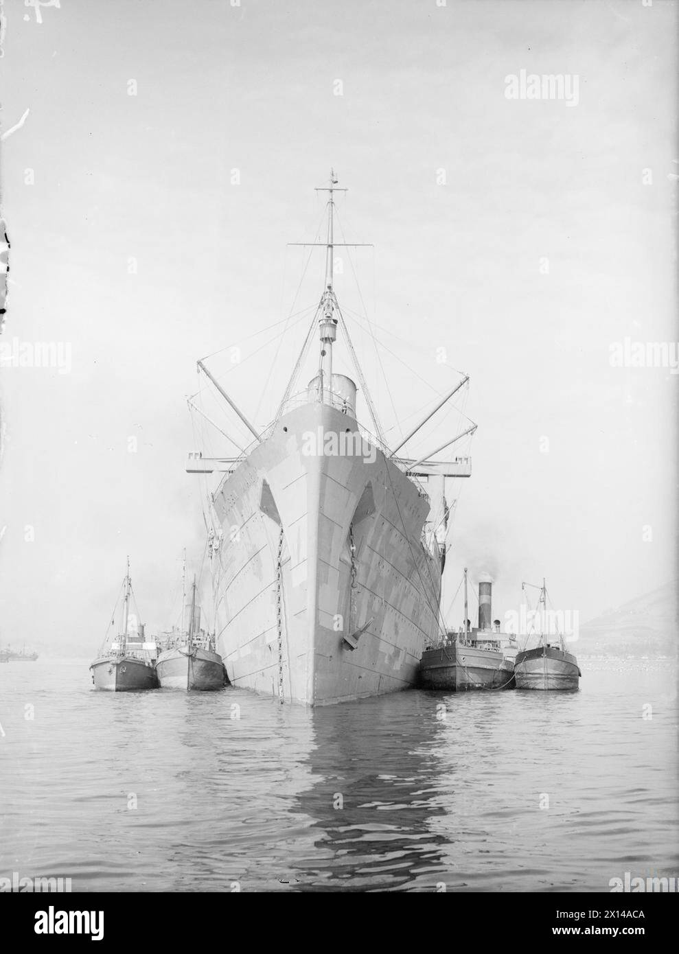 FORMER LUXURY LINER, NOW TROOPSHIP, SS QUEEN MARY AT A BRITISH PORT. 21 ...