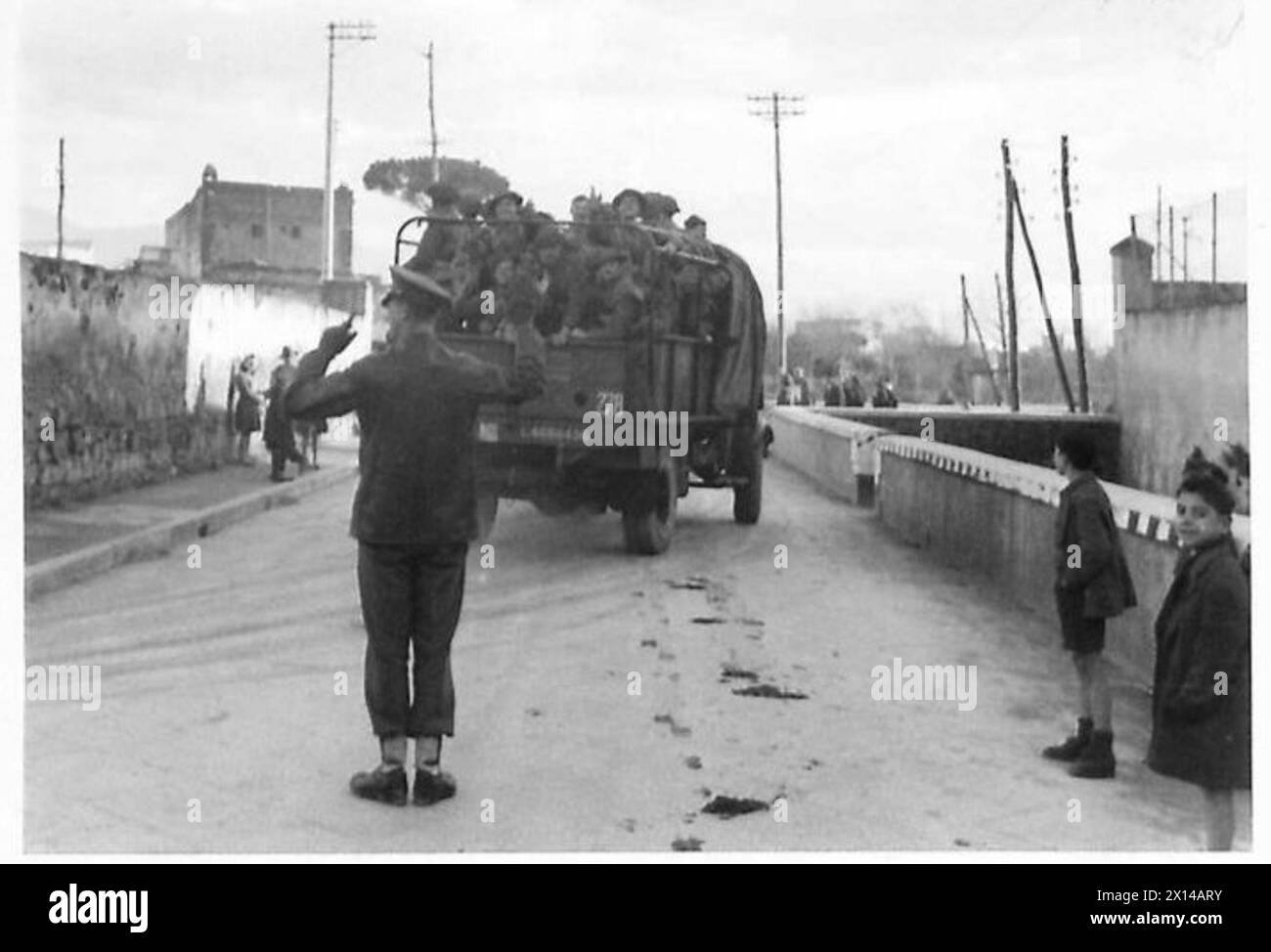 Regimental policeman controls traffic as the 1st Battalion, Scots ...