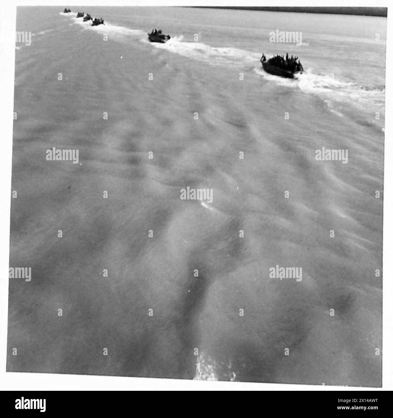 Landing craft are deployed on the sea during a combined operations exercise conducted by the ...