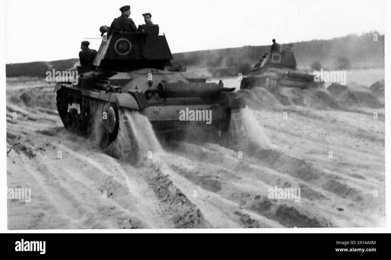 TANKS IN ACTION - Two of the cruiser tanks here seen moving off over ...