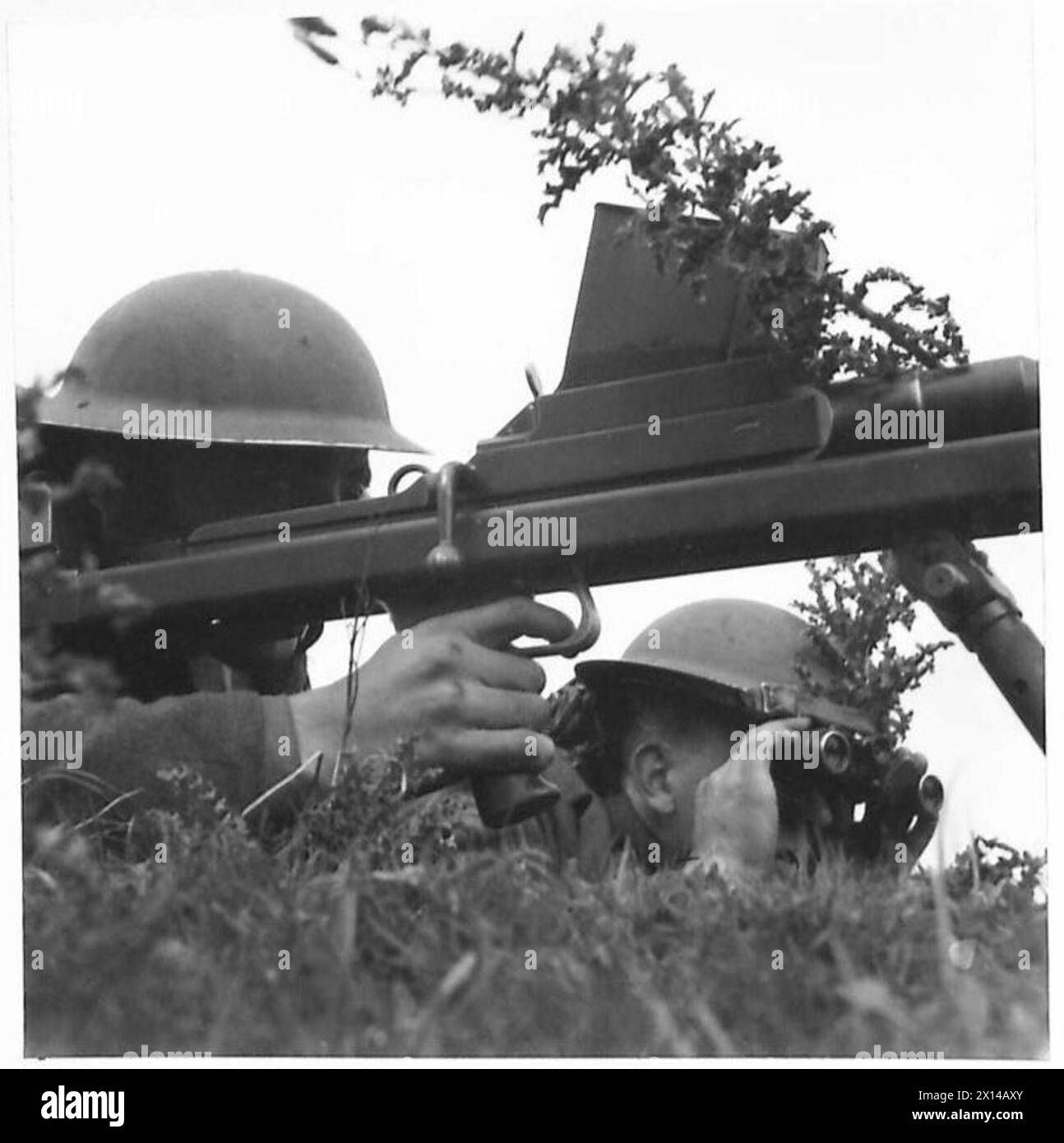 THE EYES AND EARS OF THE ARMY - An anti-tank gunner in action British ...