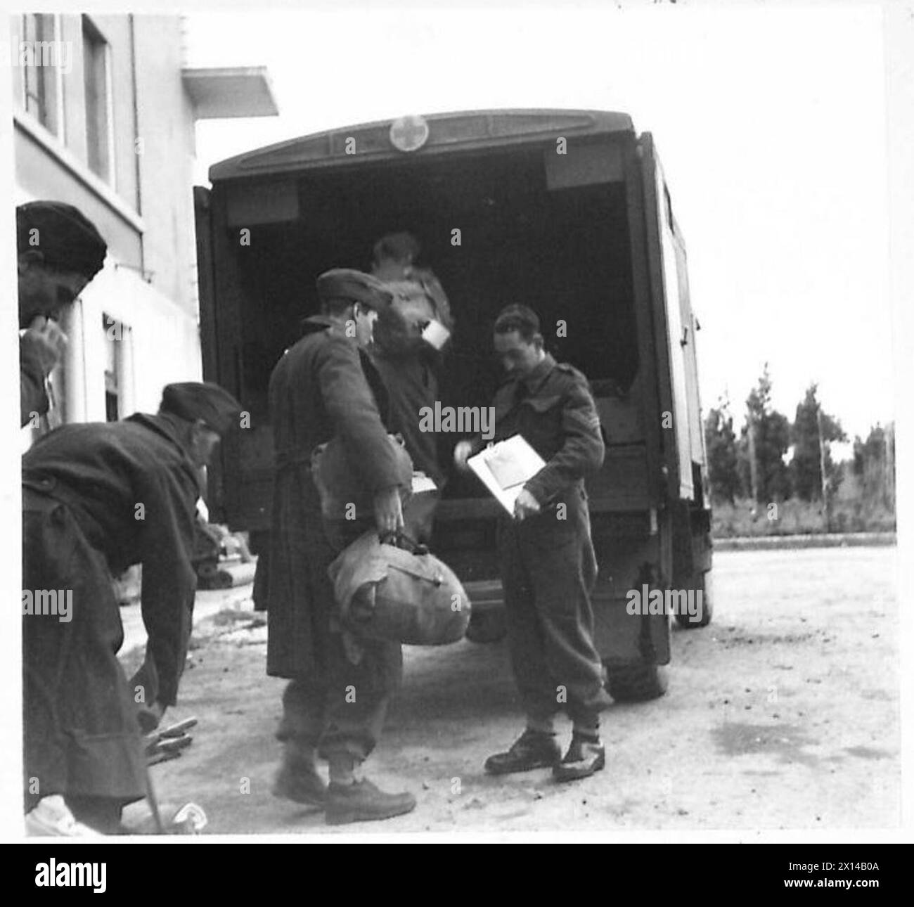 Walking wounded soldiers are assisted into ambulances during air ...