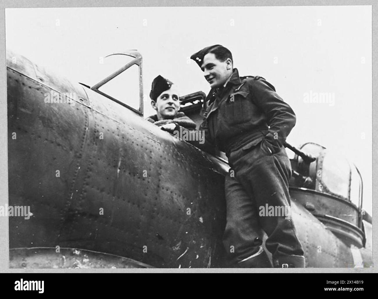 Photograph shows Sergeant Lacey in the cockpit and Sergeant Allen of ...