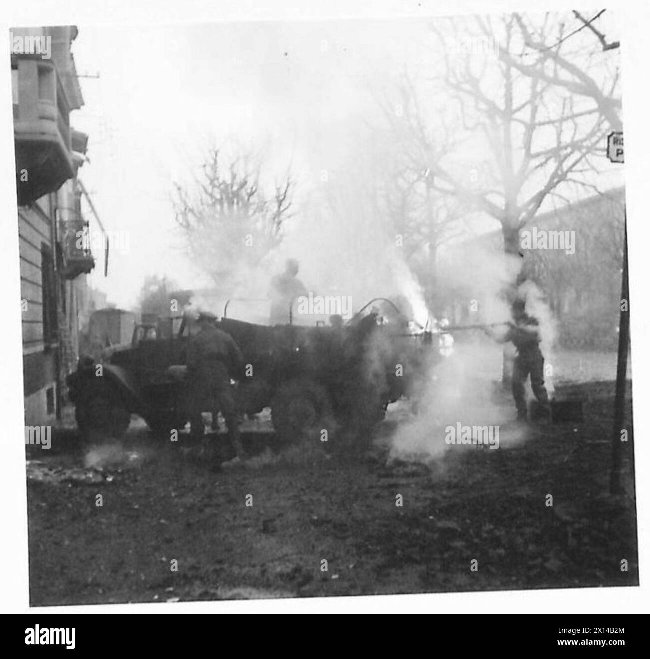 EIGHTH ARMY : FAENZA - Troops working hard to quell the flames from an ...