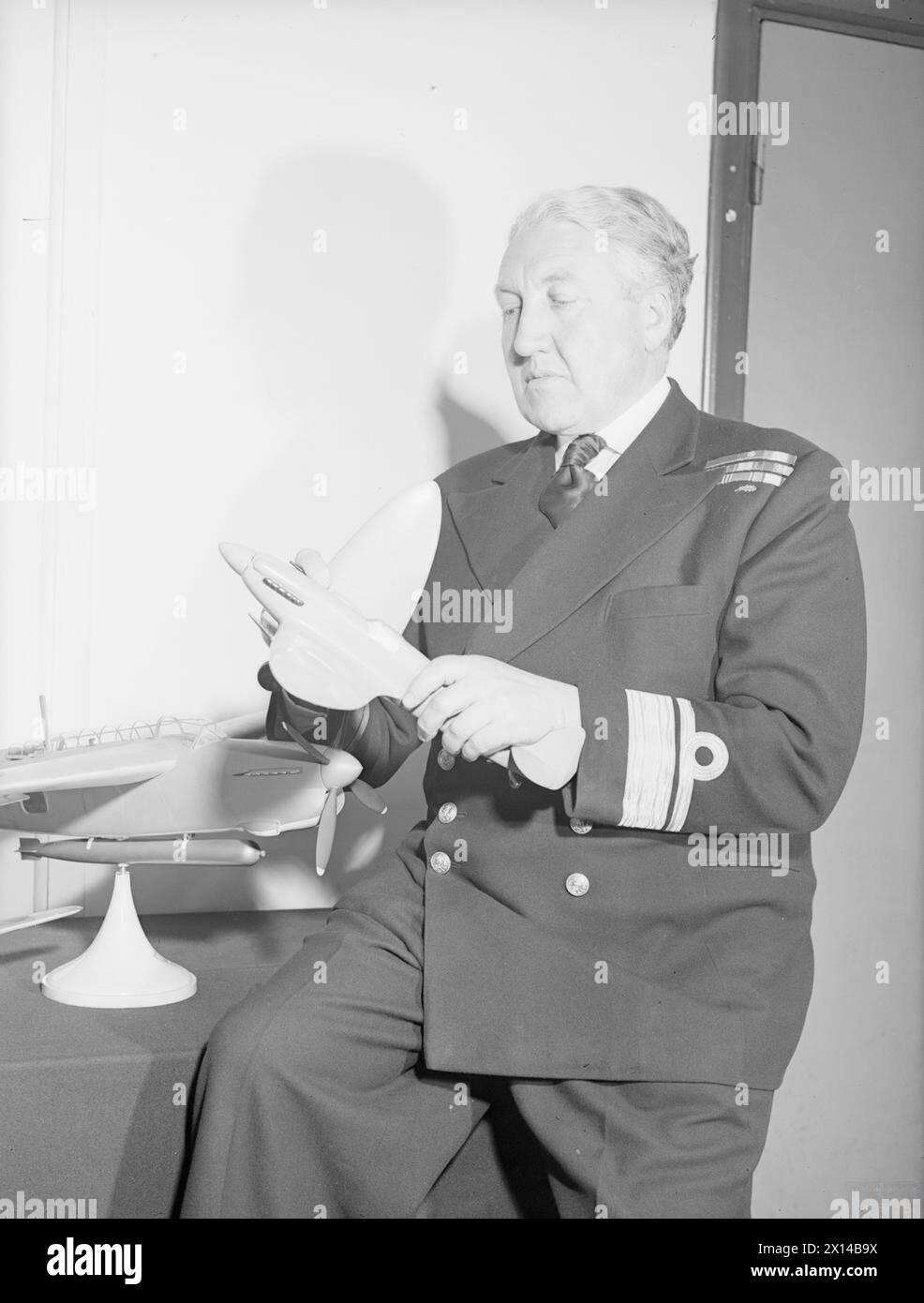 BRITAIN'S NEW FIFTH SEA LORD. 4 MAY 1945, REX HOUSE, LONDON. REAR ...