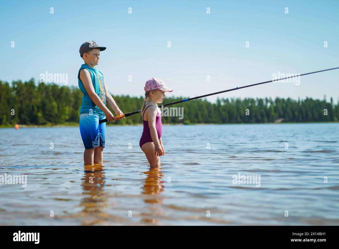 Young girl standing holding fish hi-res stock photography and images ...