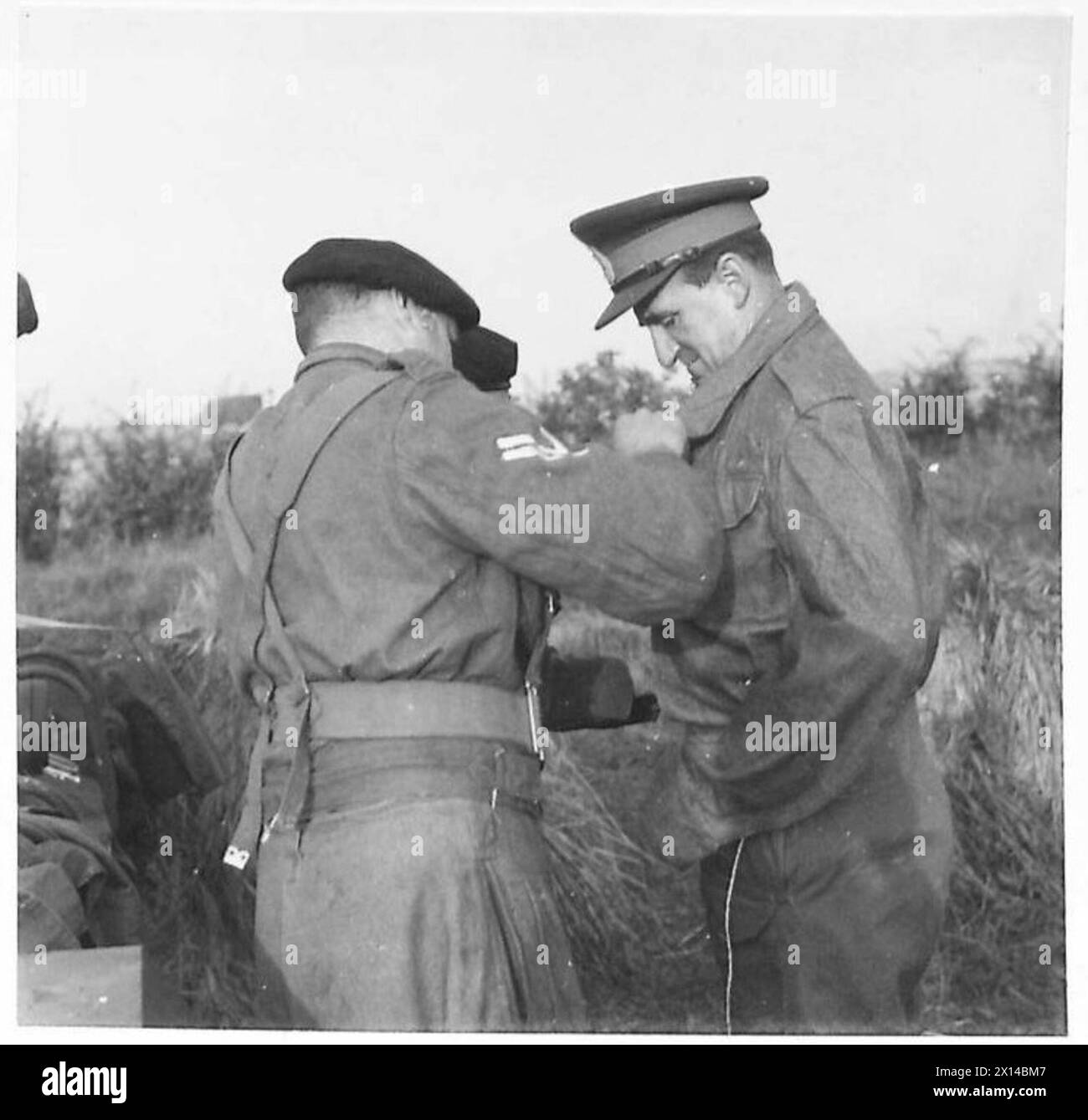 A Corporal from the Royal Armoured Corps adjusts General Sir Bernard ...