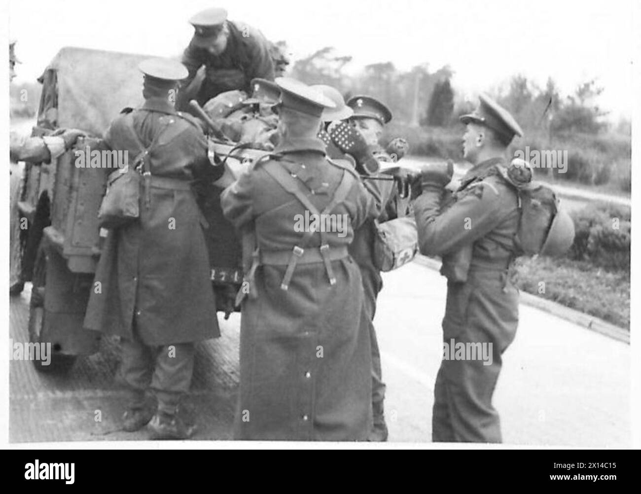 TWO DIVISIONS IN A MOCK BATTLE - A "casualty" being dealt with by ...