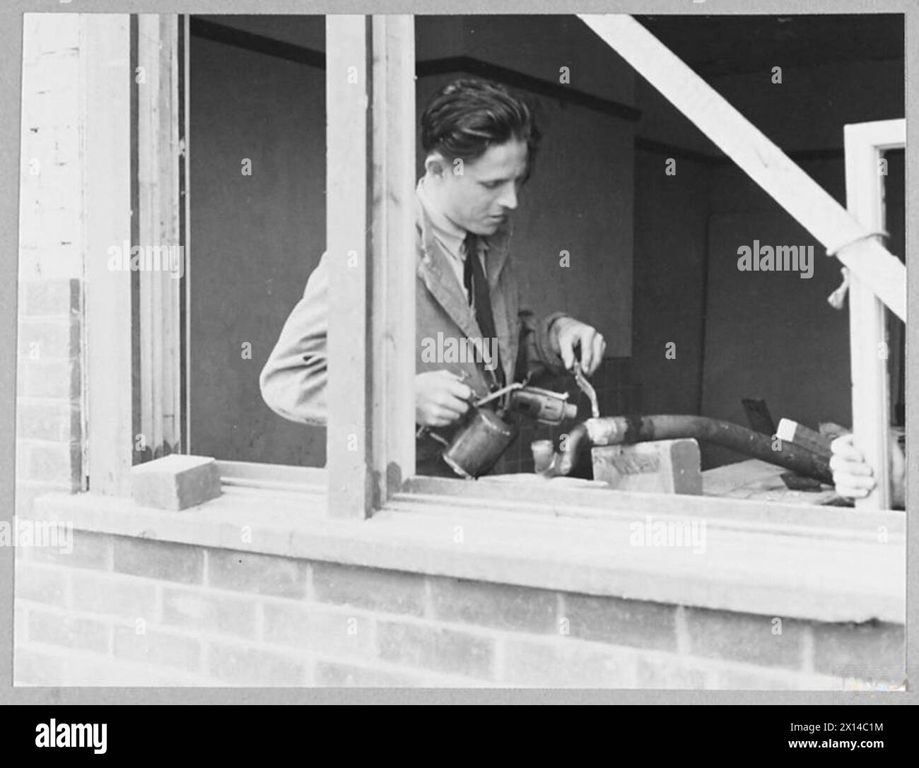 In 1945, RAF airmen assist town rebuilding. Leading Aircraftman F.W ...