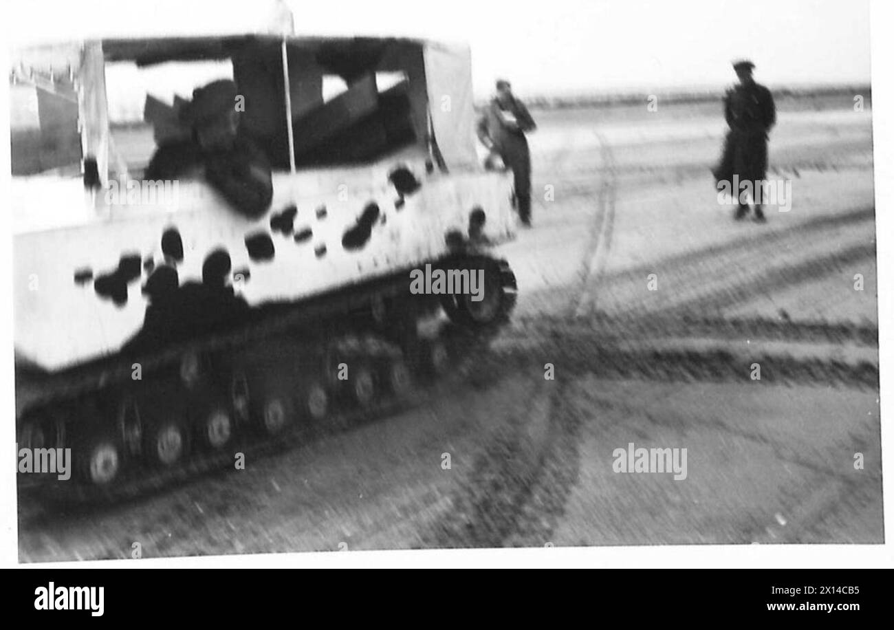 The 79th Armoured Division's 'Weasel' vehicle is shown crossing a small ...