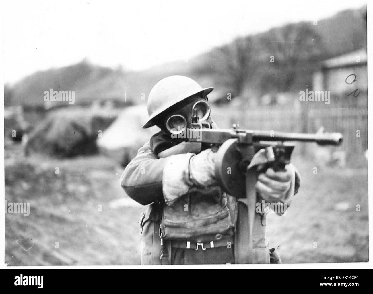 A motorcyclist armed with a Tommy gun is observed during troop ...