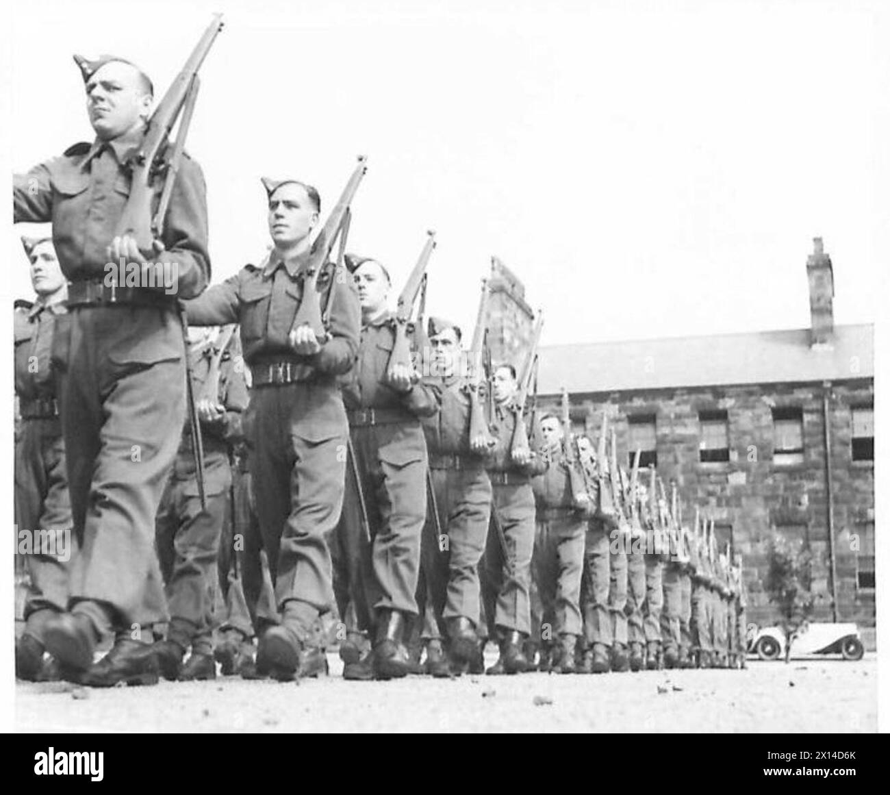 Photograph showing Royal Engineers personnel marching on a barrack ...