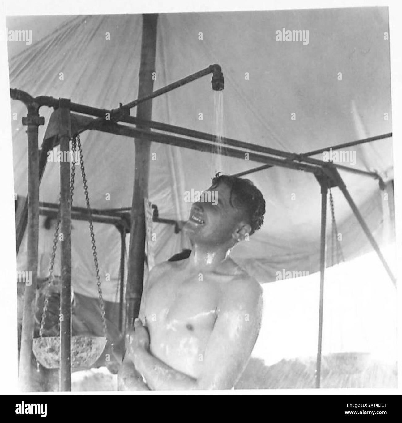 British Army troops take hot showers in the Western Desert during field ...