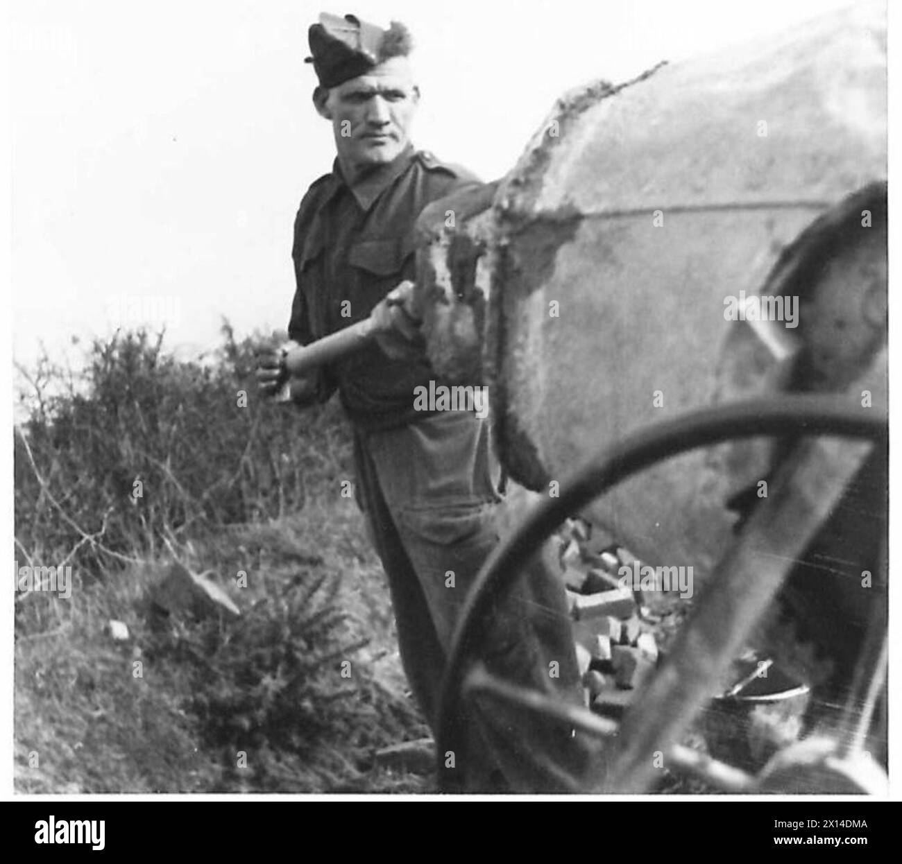 Pioneer Corps personnel operate a cement mixer as part of construction ...