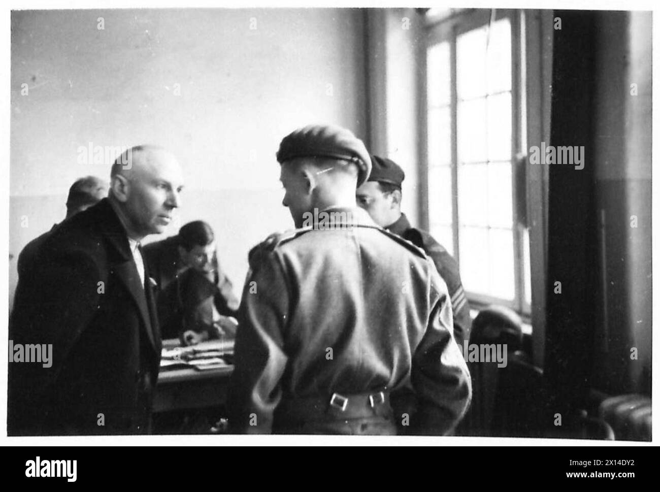 MILITARY GOVERNMENT GOES INTO ACTION - A German is screened by Field ...