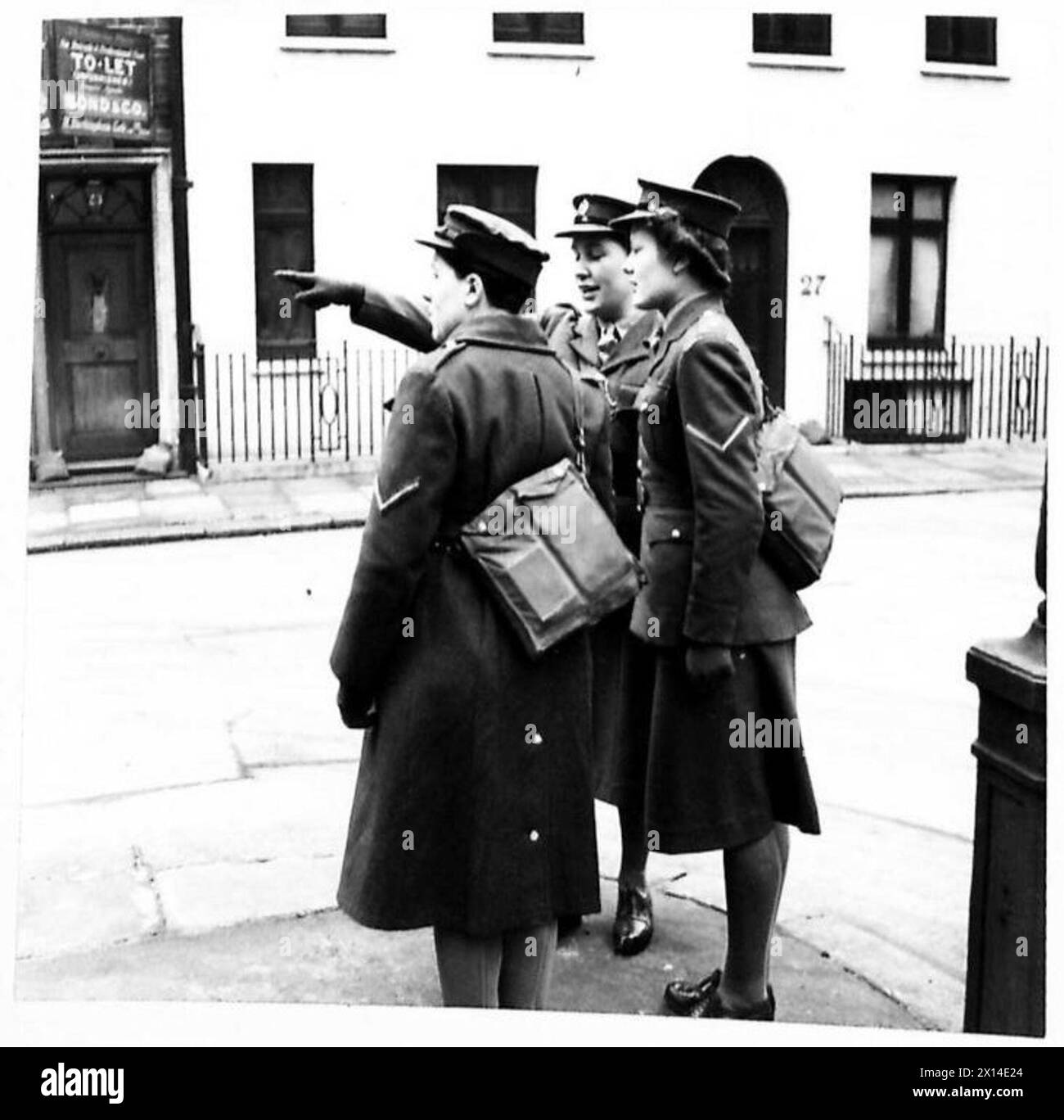 ATS MILITARY POLICE - Two ATS Redcaps directing an ATS L/Cpl. in London ...