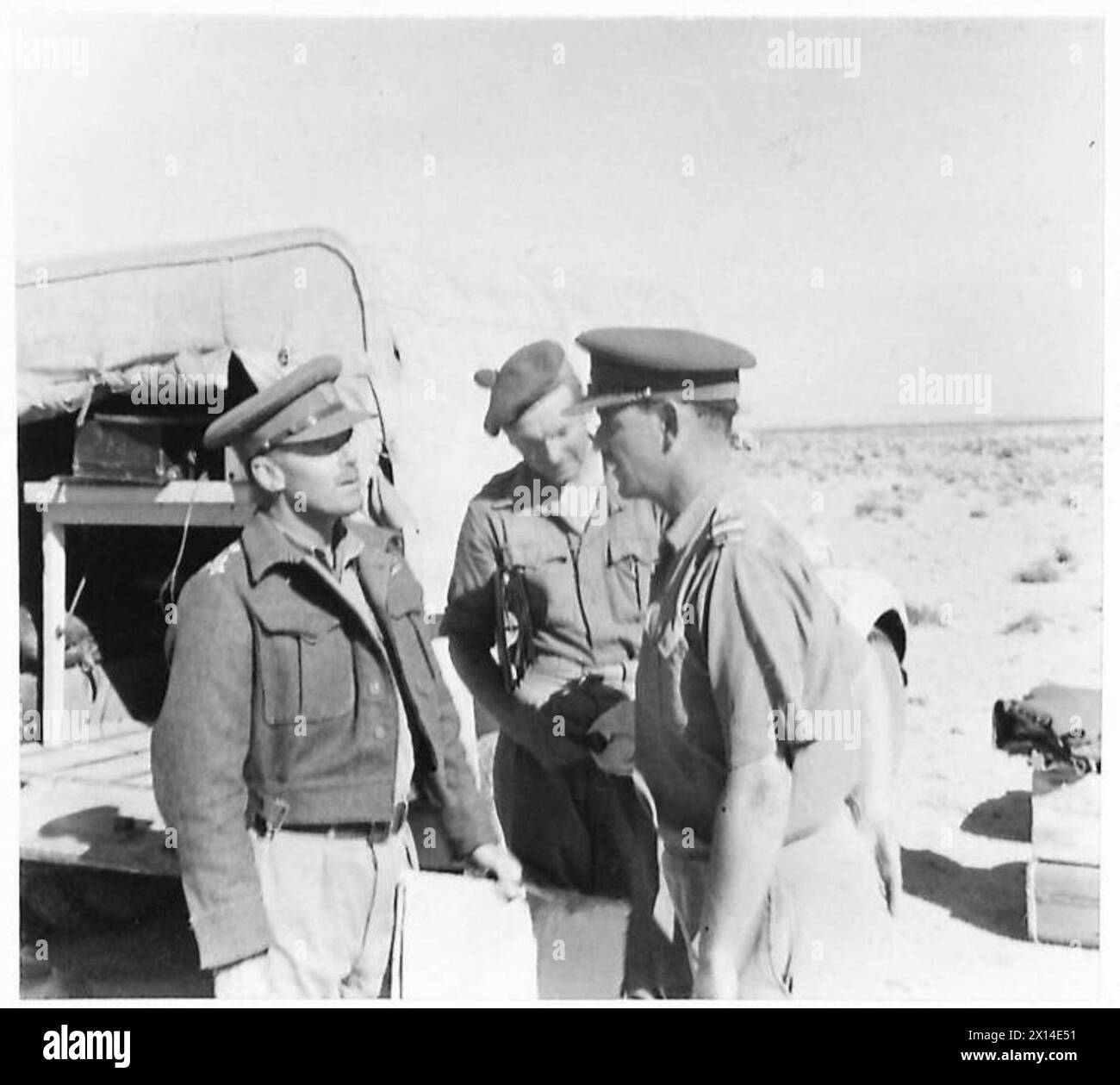 Brigadier R.A. Savory speaks with a staff officer during the British ...