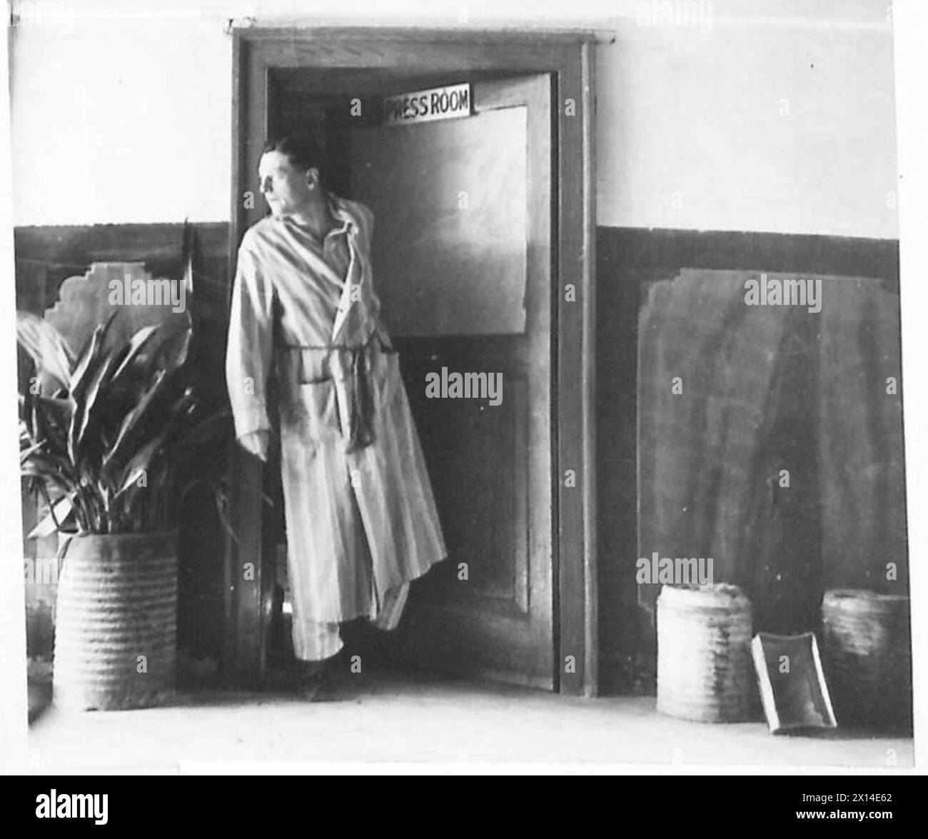 Edwin Tetlow of the Daily Mail exits the Press Room wearing a bathrobe ...