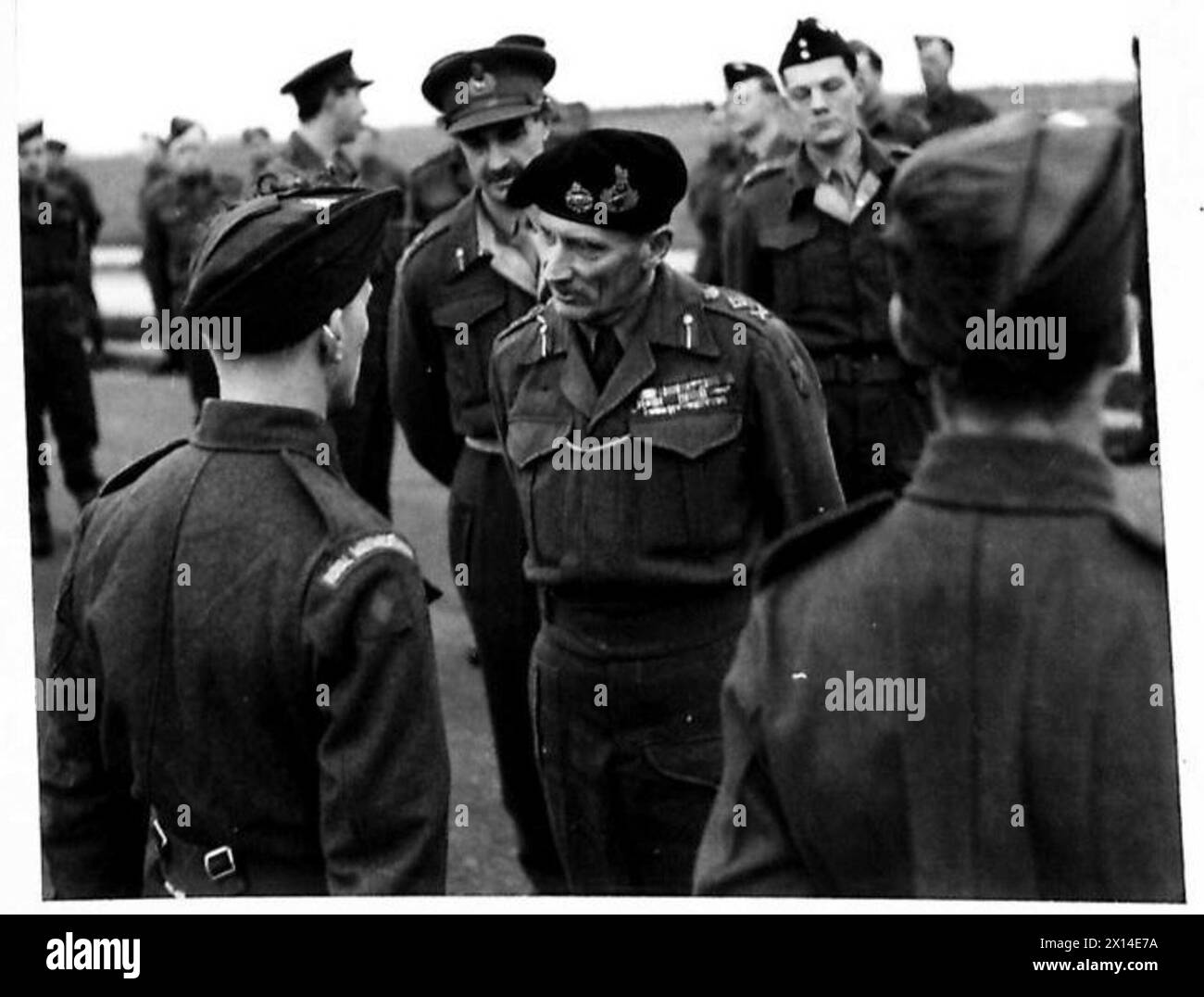 General Montgomery recognizes and speaks to Private J. Roach of the 1st ...
