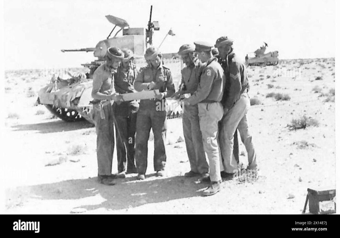 AMERICAN TANKS IN THE DESERT - Some of the crews discussing plans ...