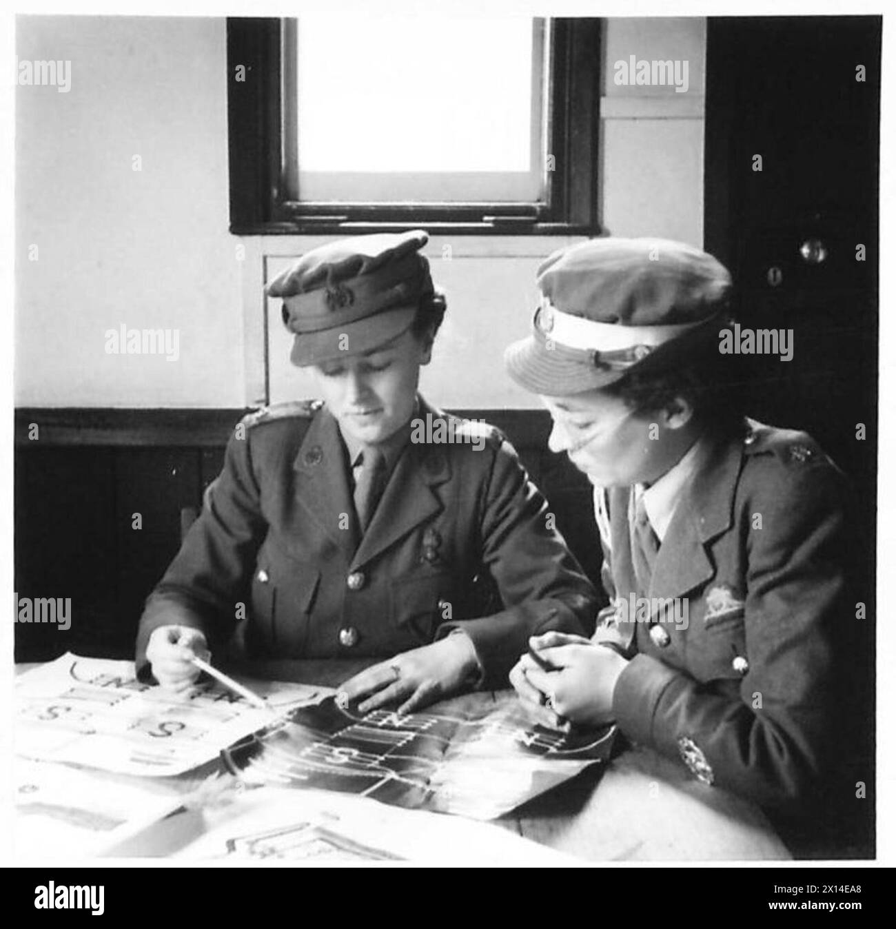 Subaltern Joan Cotter and Sgt. Major Bain, ATS personnel, review a ...
