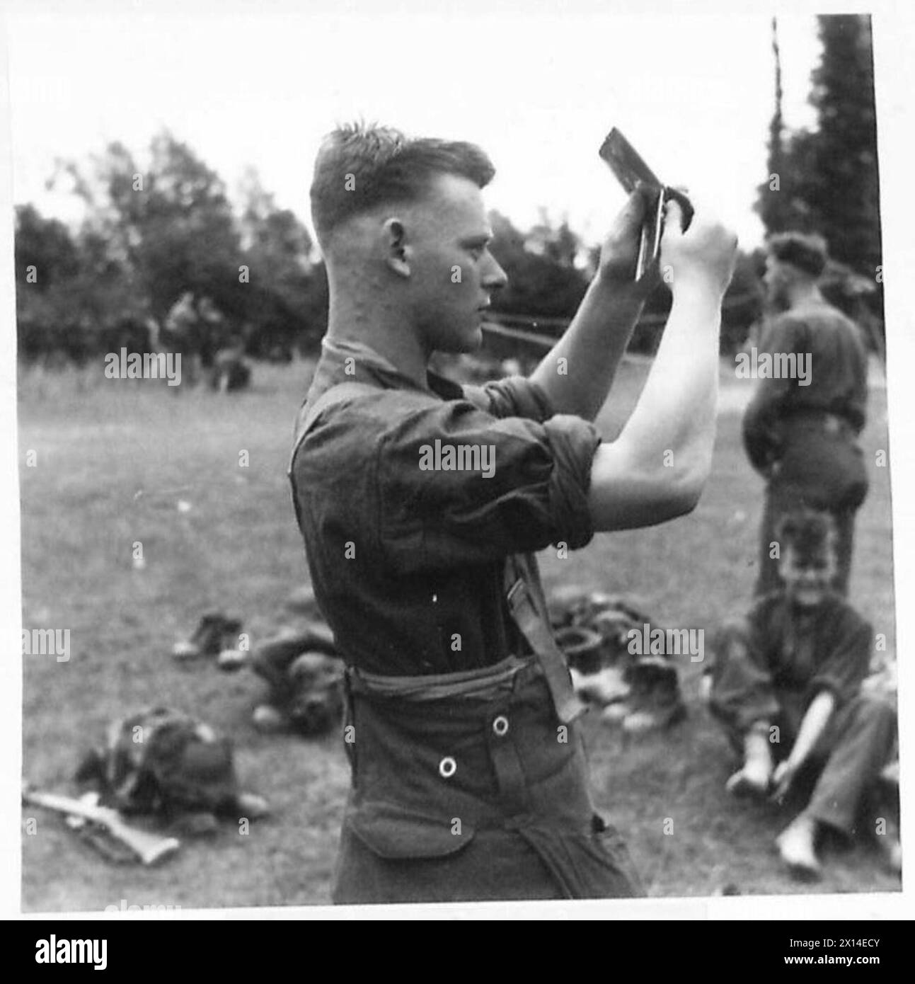 BRITISH TROOPS TAKE A BATH - Rifleman Tarrell of Dagenham, London, puts ...