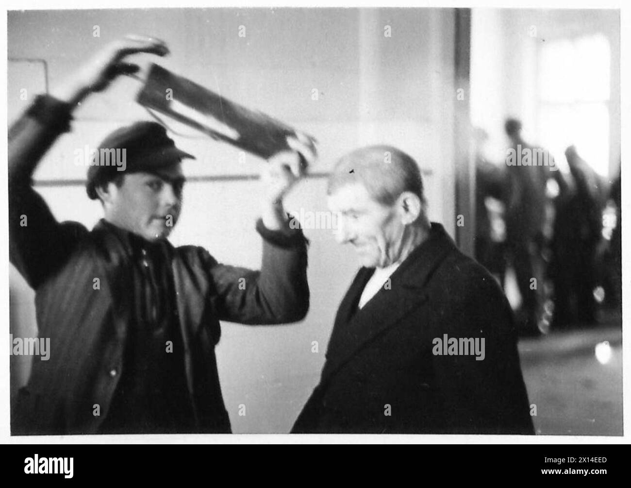 A German civilian is treated with anti-vermin powder under the ...