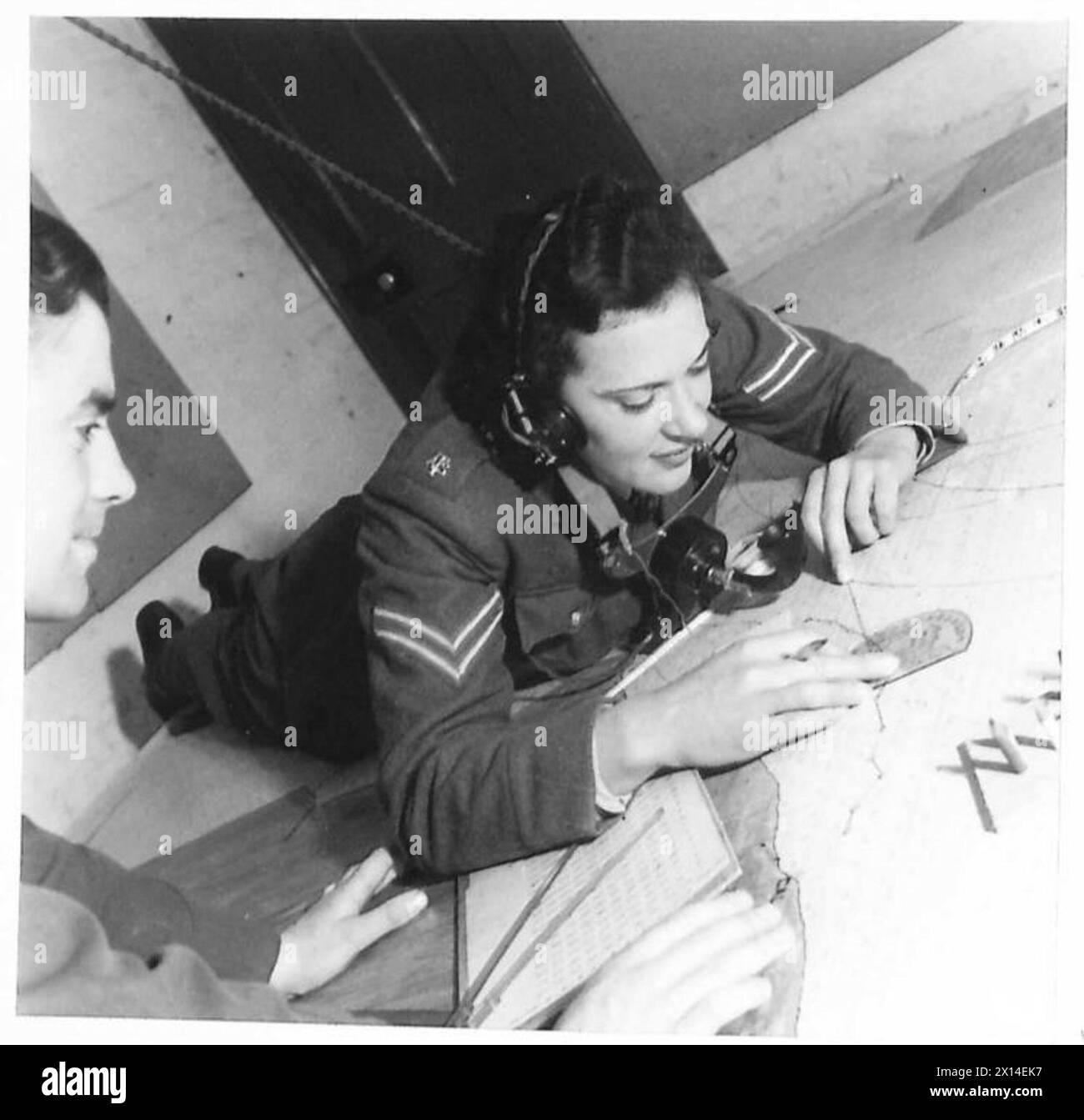 ATS PLOTTER GIRLS - Corporal Vivian Ashby of the ATS is seen at work in ...