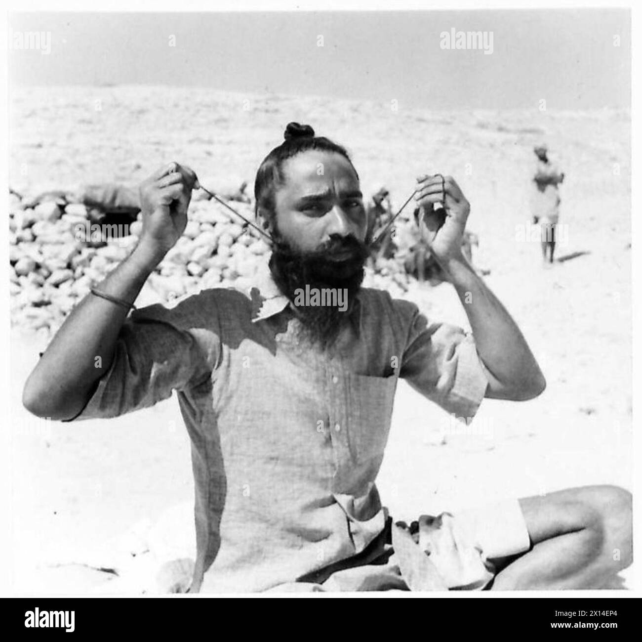 Sikh soldiers in the Western Desert perform the morning routine of ...