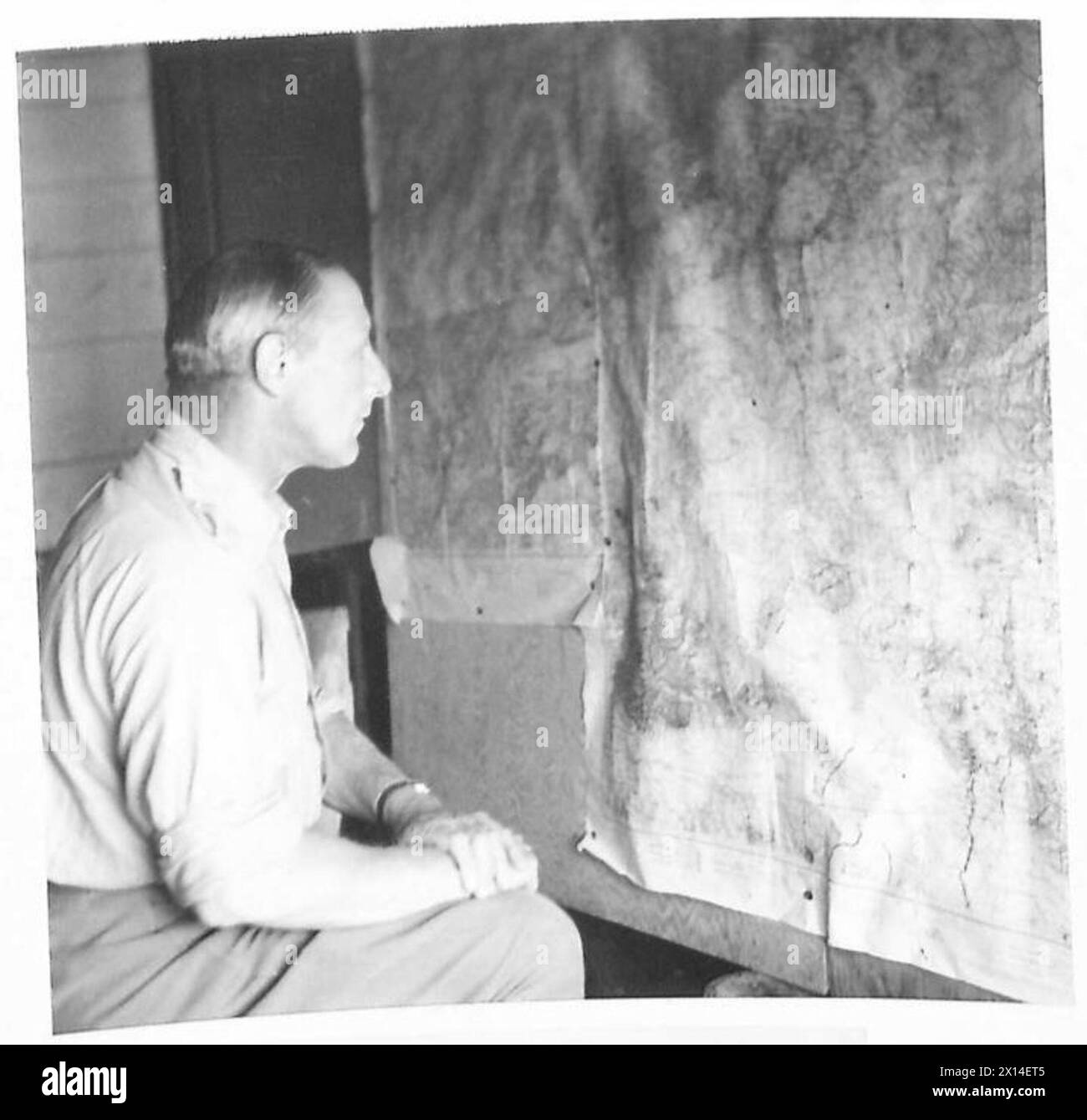 A WEEK WITH THE FIRST ARMY COMMANDER - General Anderson studying a map ...