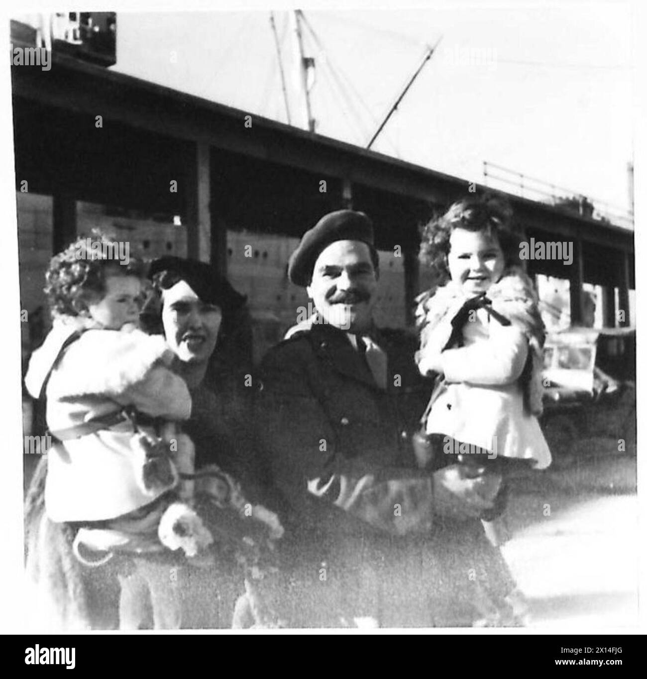 C.M.F. FAMILIES ARRIVE - Capt. Muckersie with his wife and two children ...
