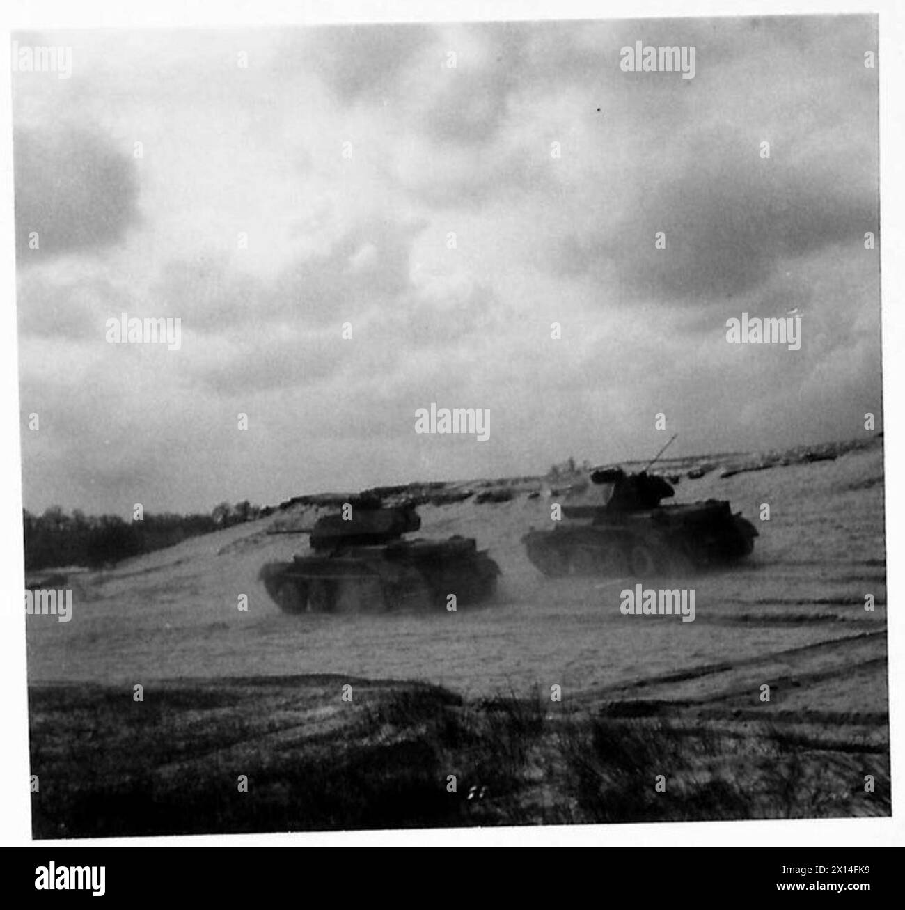 TANKS IN ACTION - Two of the latest cruiser tanks crossing the sand ...