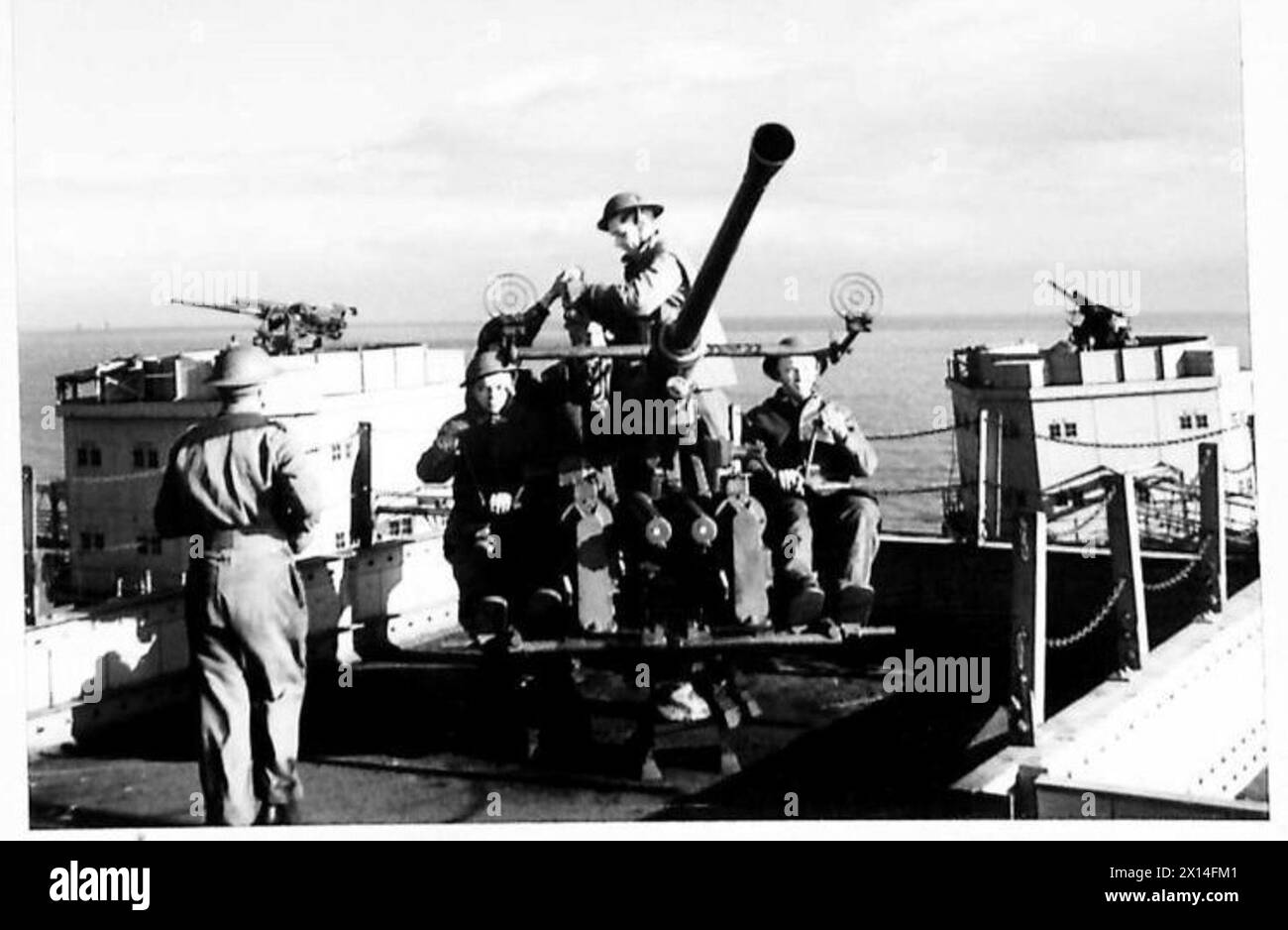 ISLAND A.A. FORTS - Bofors crew at action stations on one of the towers ...