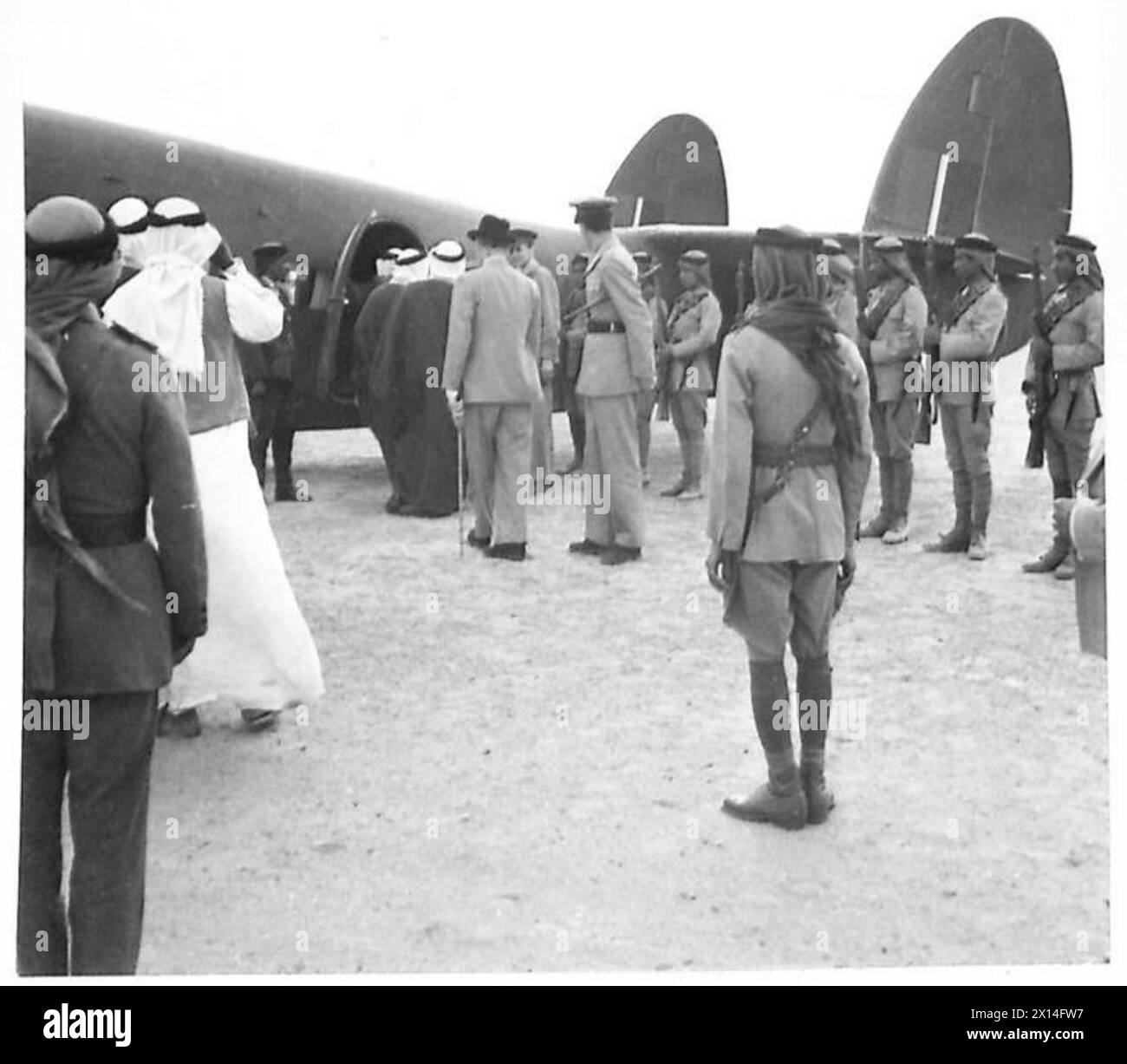 Saudi Arabian soldiers present arms as the Commander in Chief boards ...