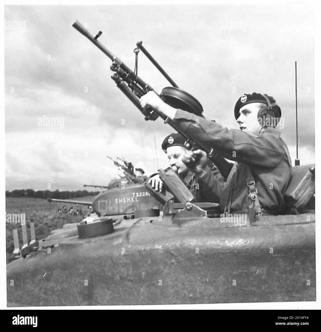 Soldiers man an anti-aircraft Bren gun mounted in a tank turret during ...